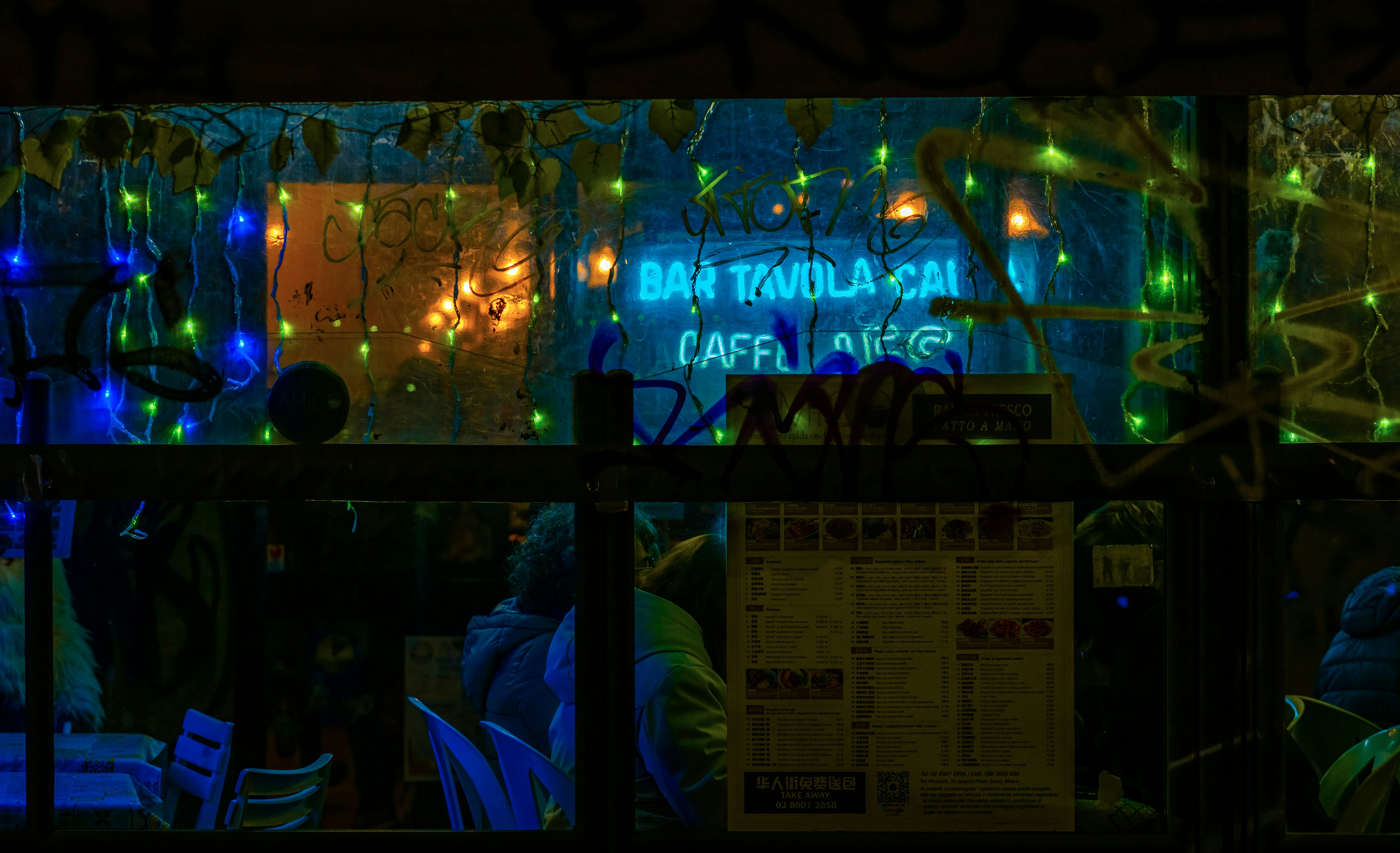 Neon Chill at Bar Tavola: Night Lights Through Glass