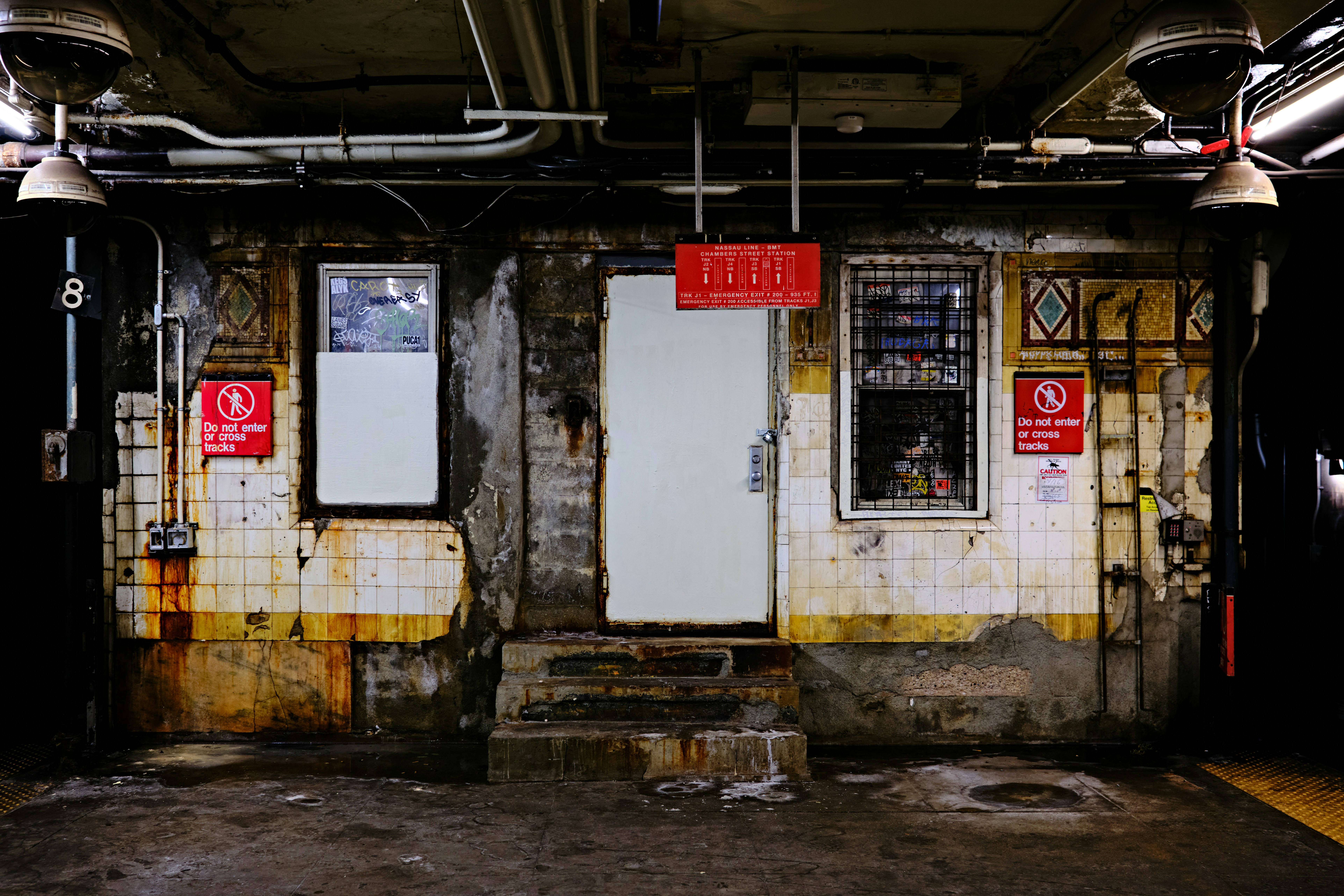 Abandoned Underground Facade: A Dull Brightness of Doors and Signs