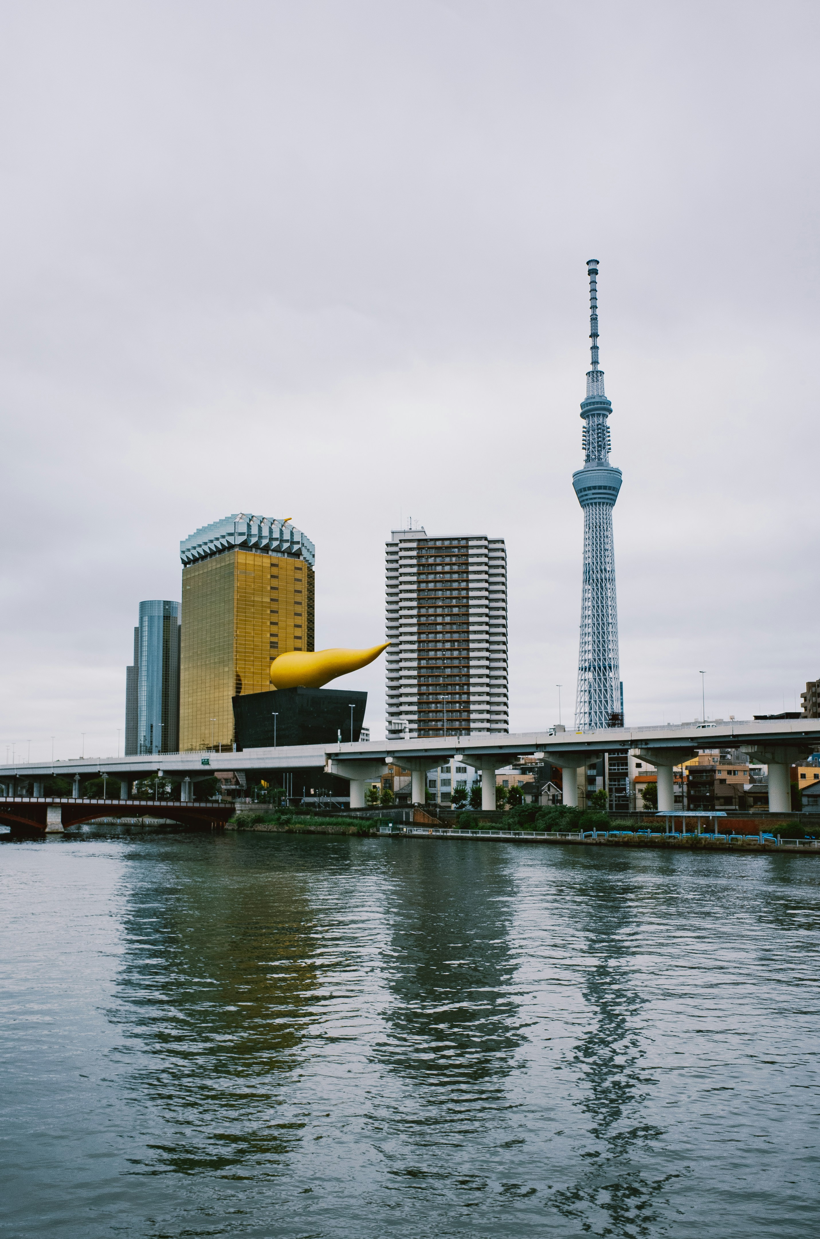 City Silhouette Over Water: Tokyo Skyline and the Needle Tower