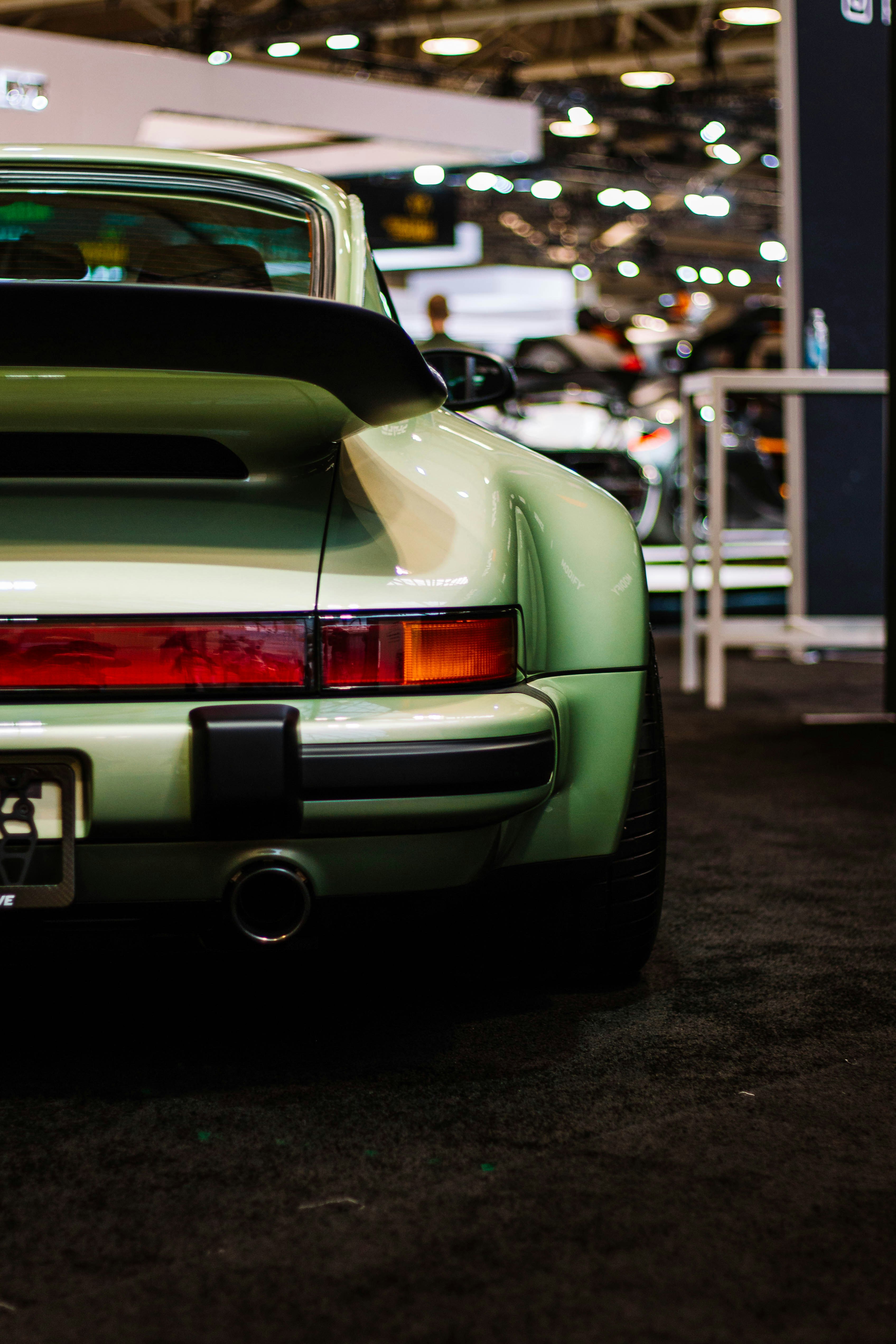 Mint Green Classic: The Rear Quarter of a Porsche at an Exhibition