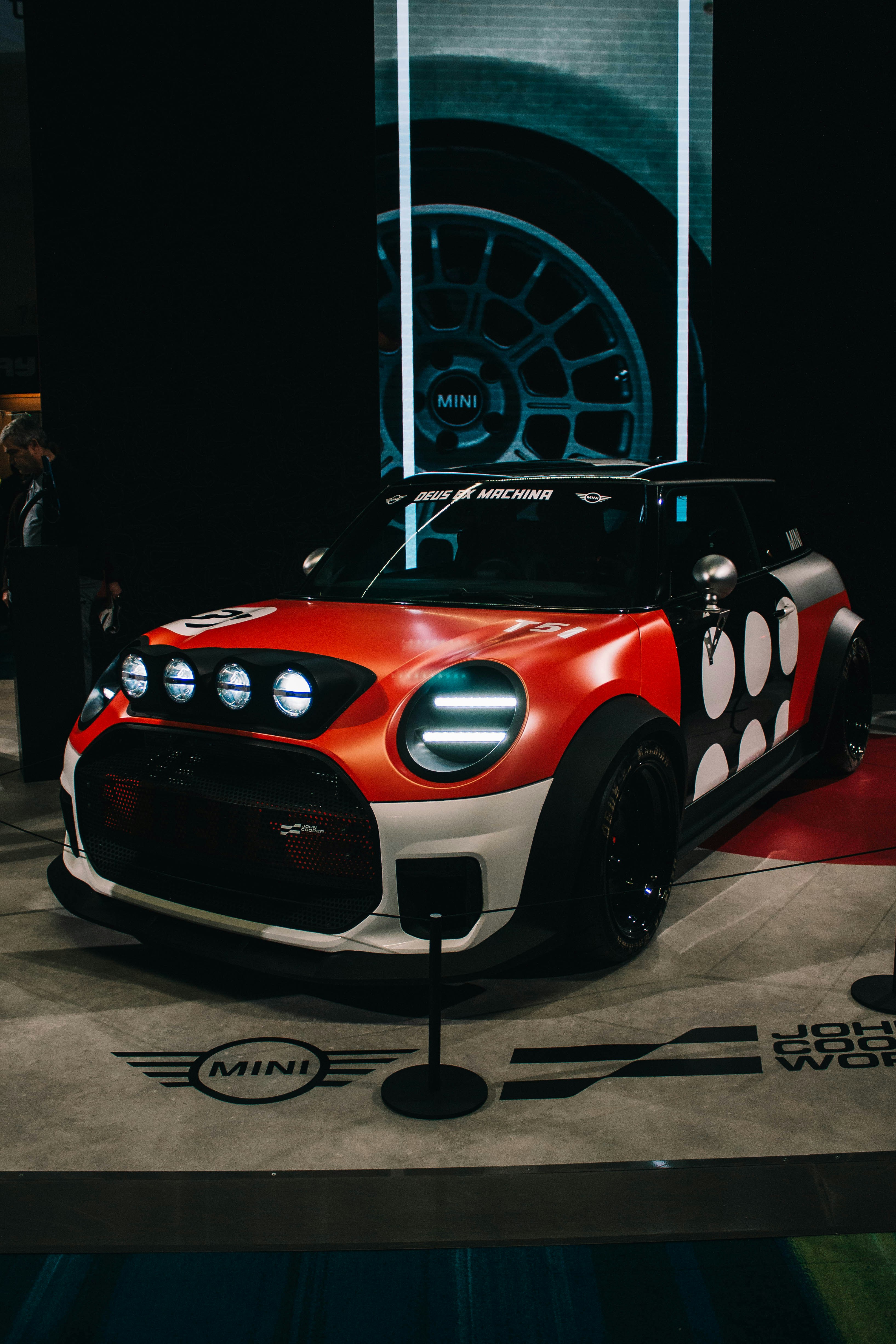 Rising Spotlight: Mini Cooper Racecar at a Show Stand