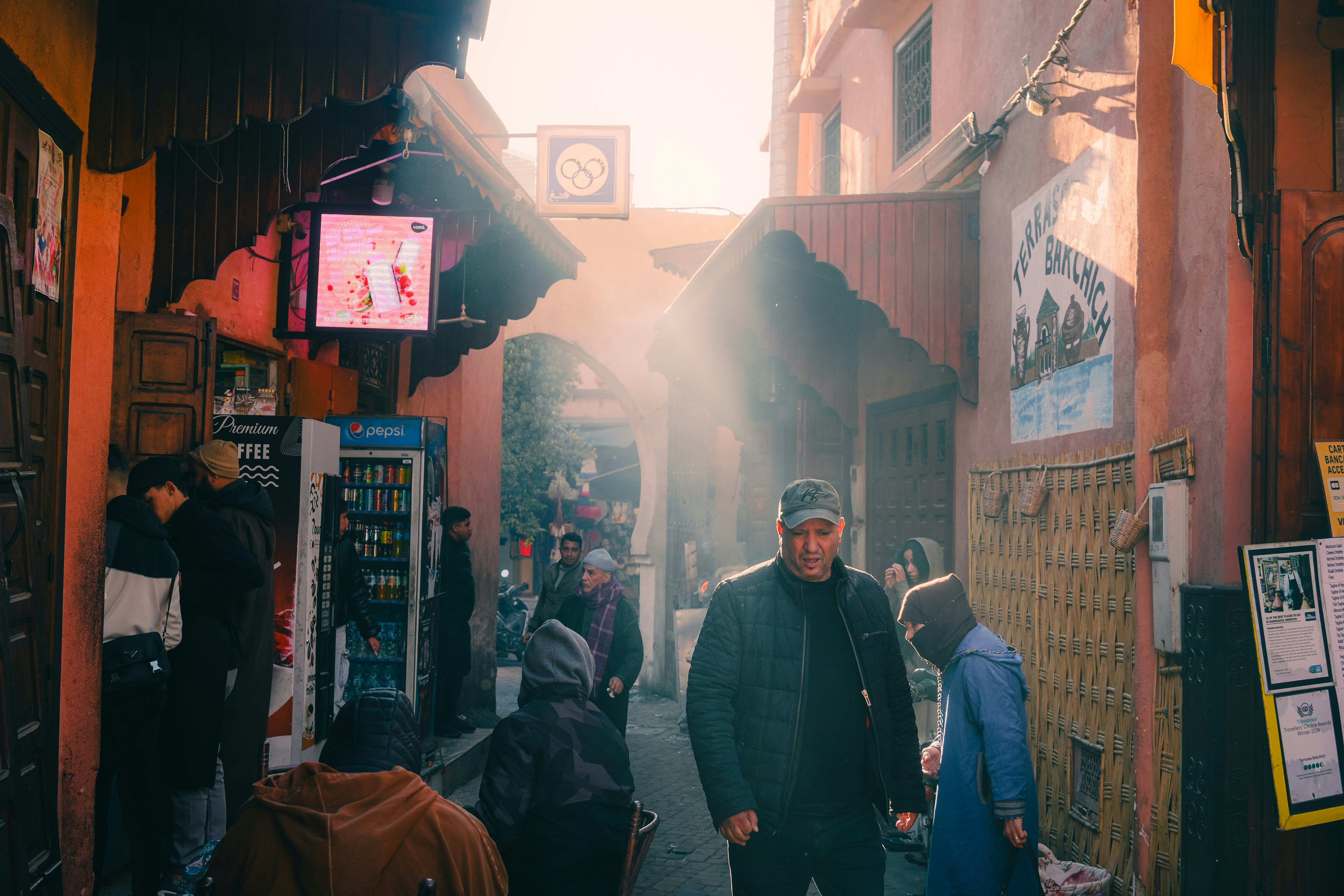 In the Lantern-lit Alley: A Quiet Moment Amid the Market Crowd