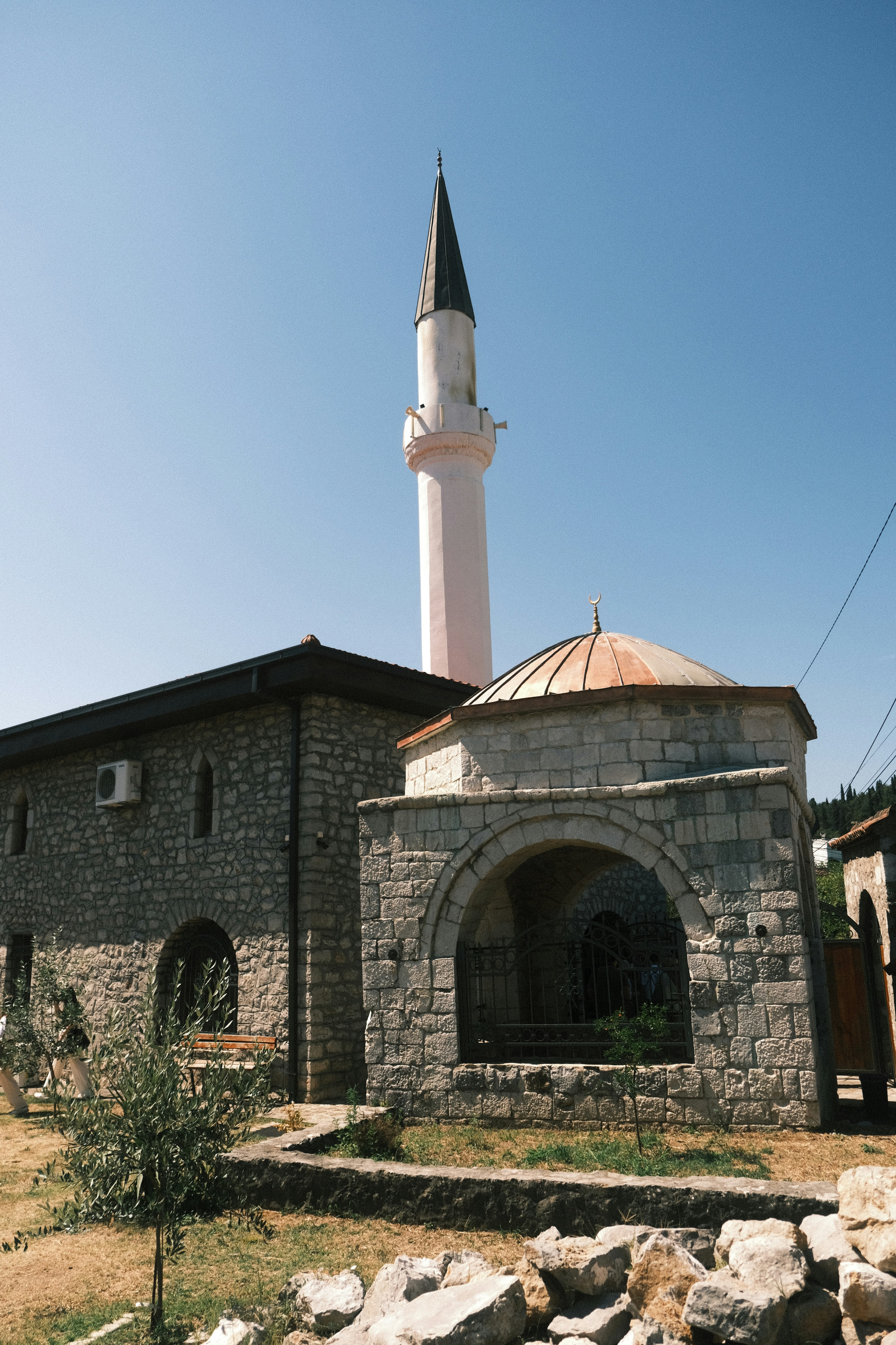 Stone Mosque Tower Against a Clear Sky