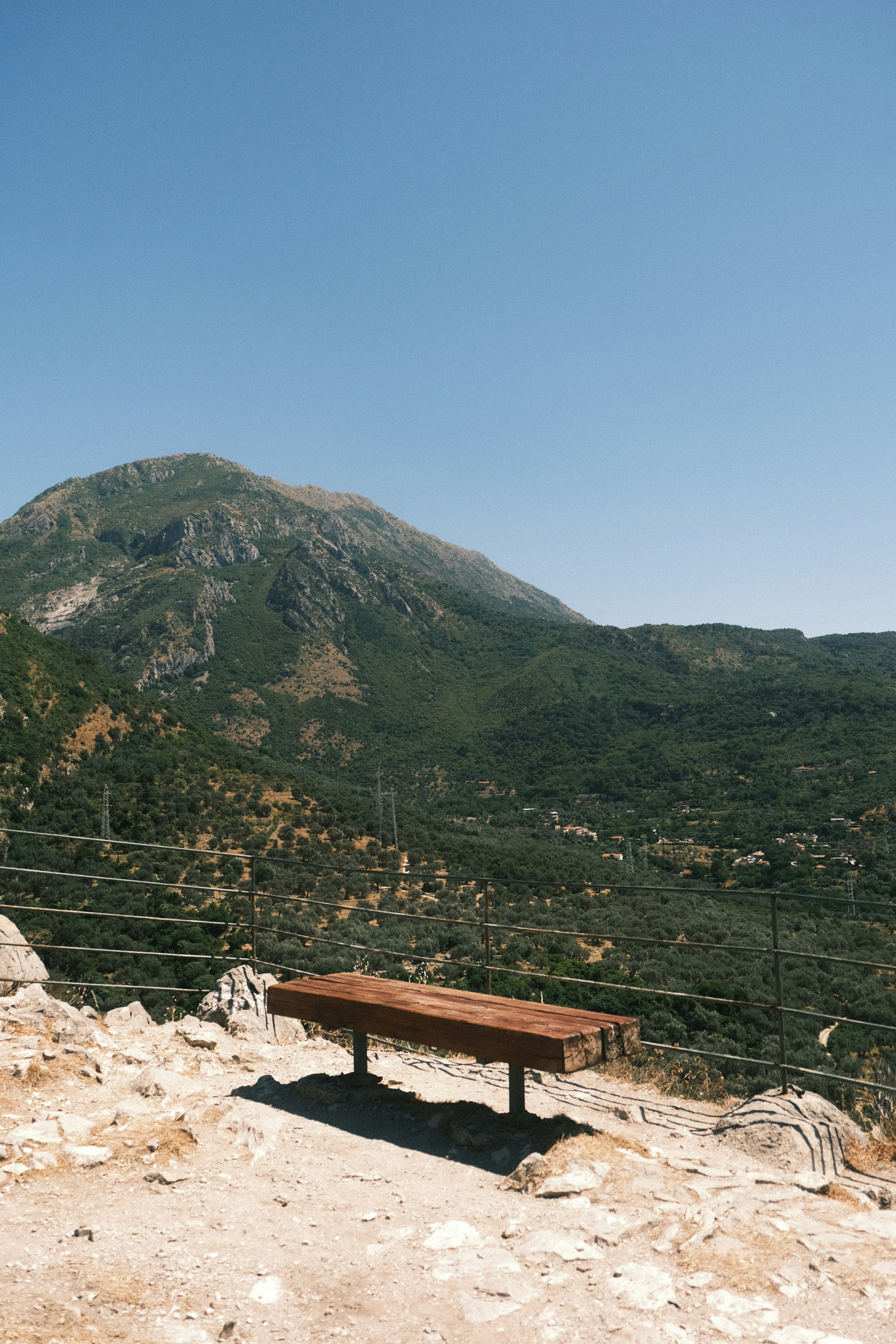 Quiet lookout with a weathered bench gazing toward ridge and valley