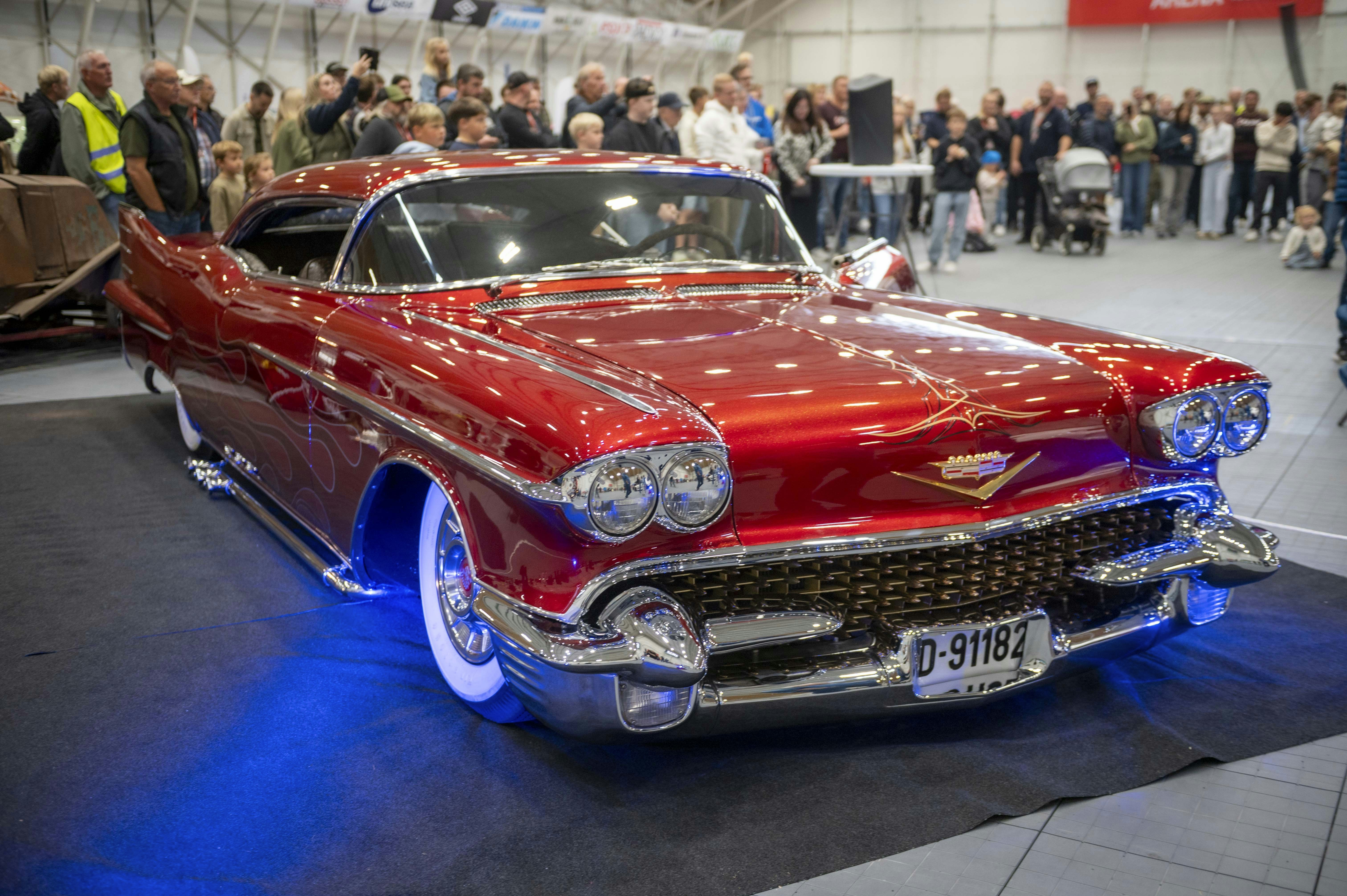 Mid-Century Crimson Automobile on Display at a Show