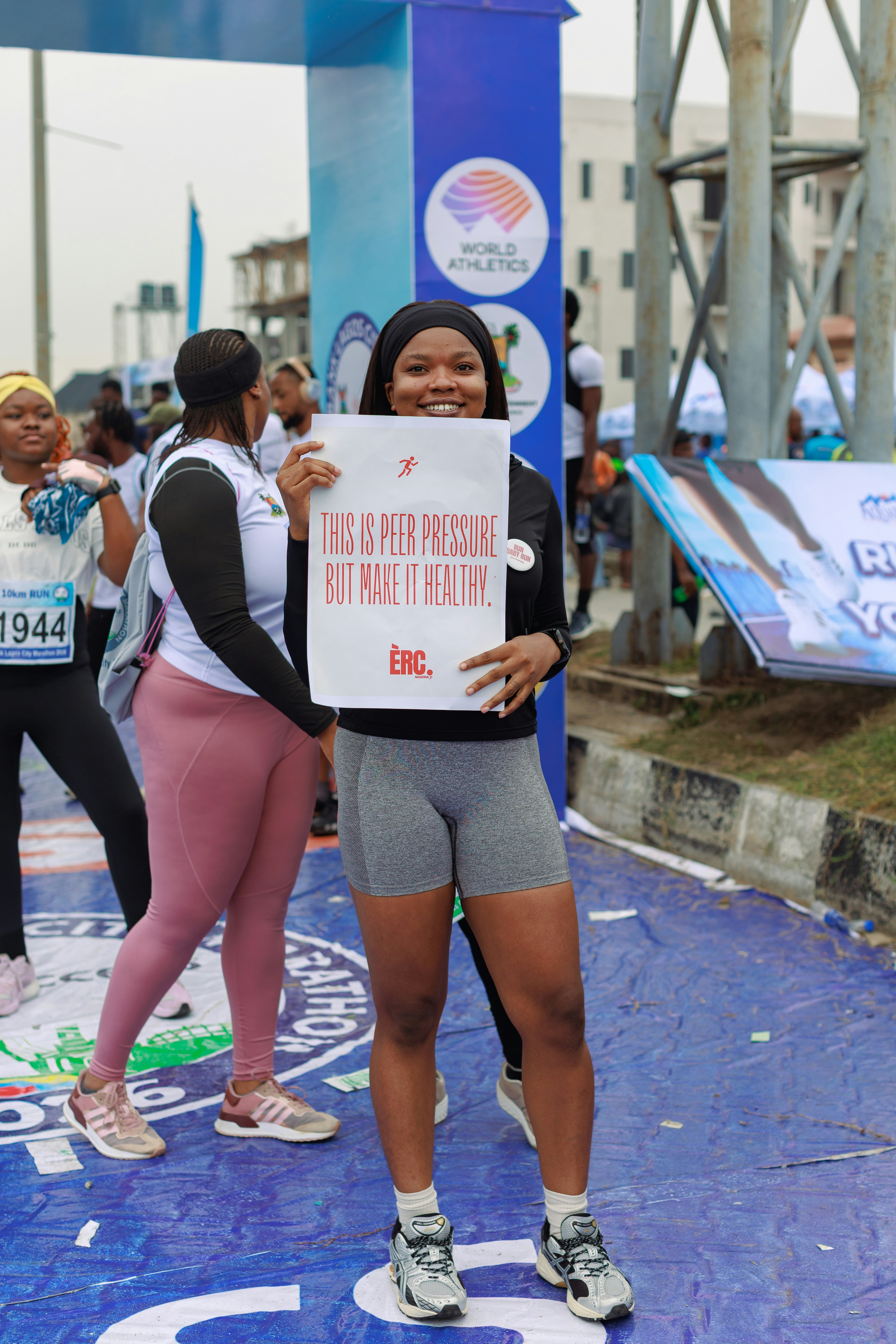 Smile and Sign: A Runner’s Message at the Finish Line