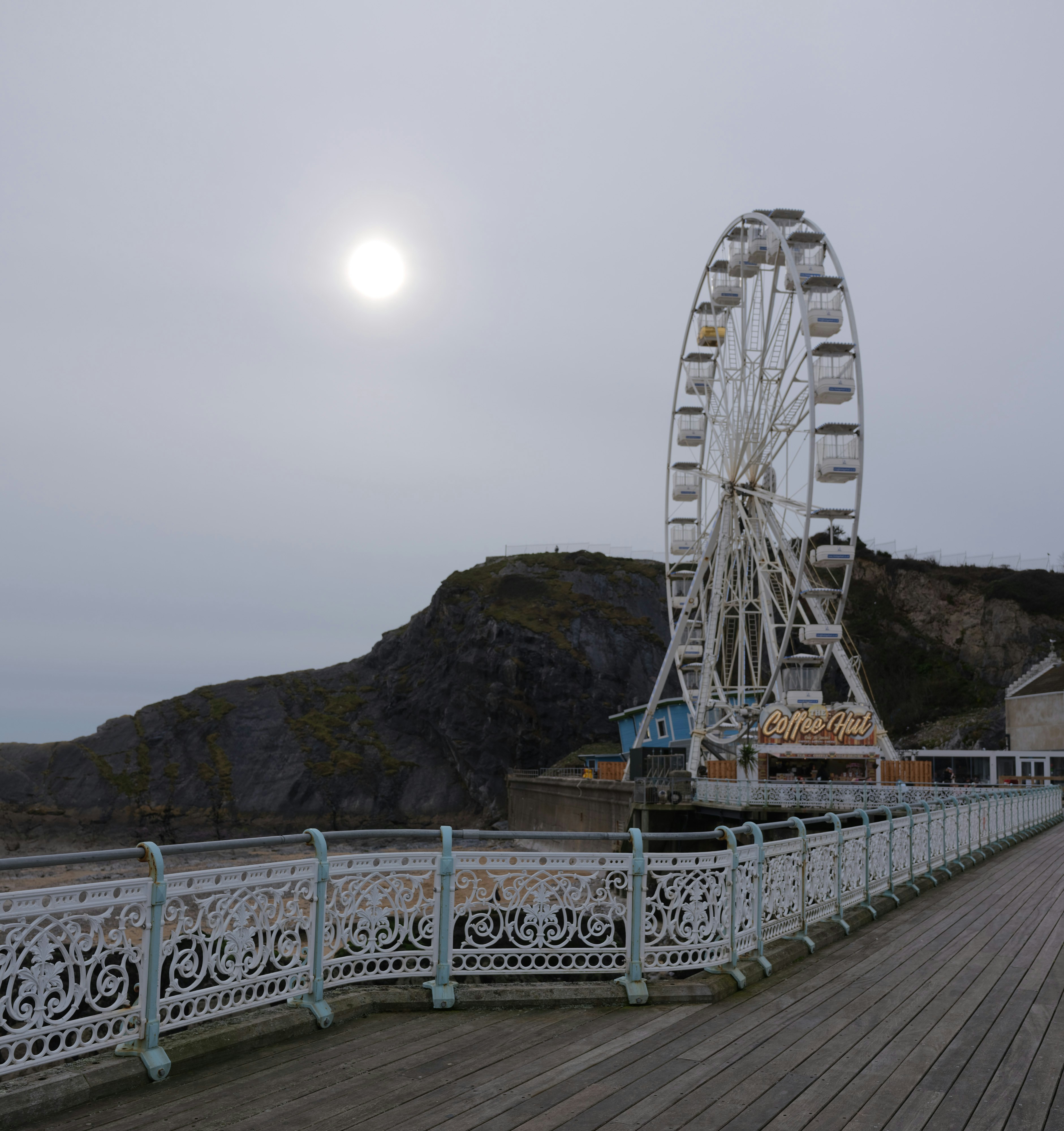Ferris Wheel by the Sea: A Quiet Pier at Dusk