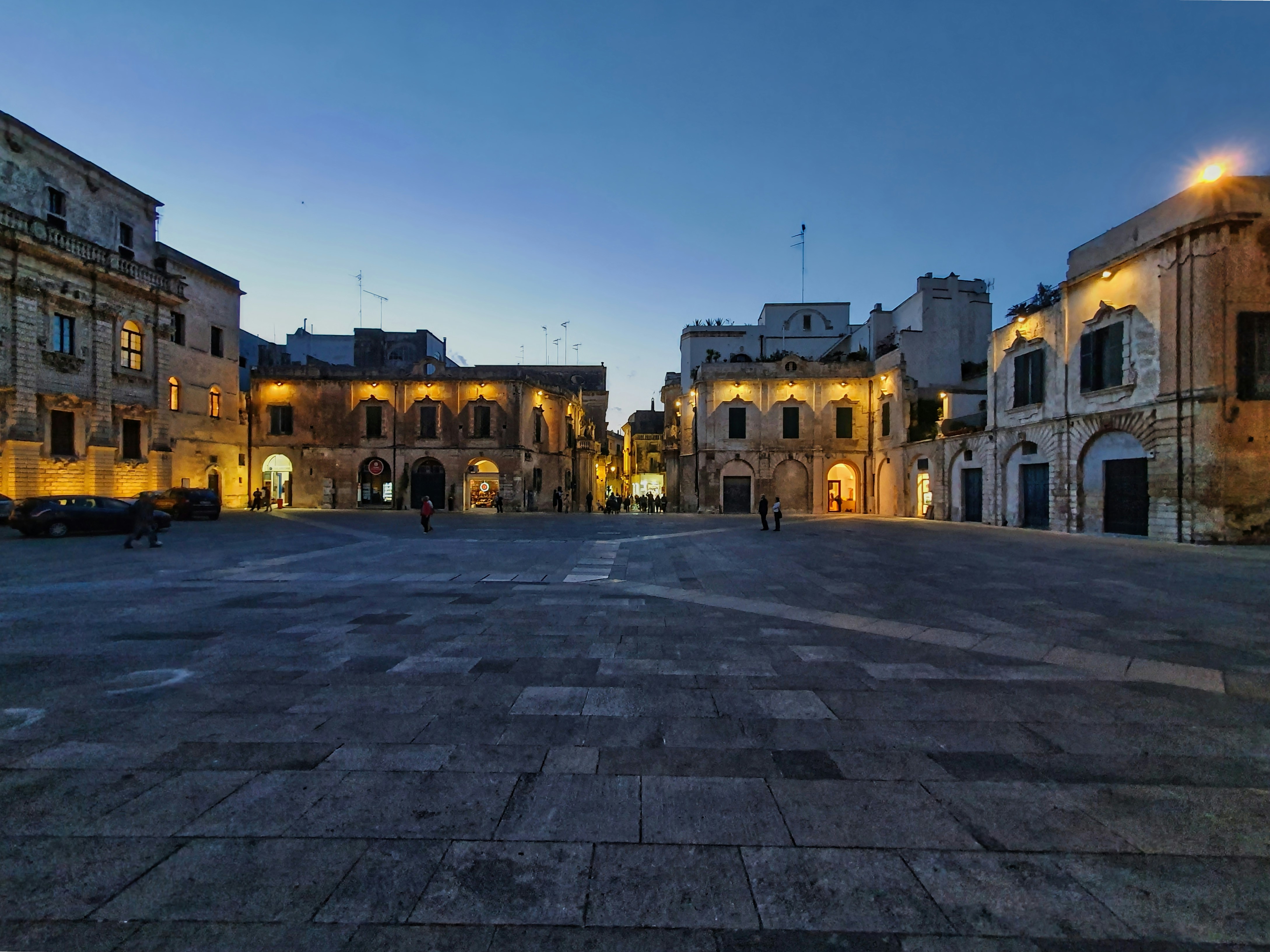 Evening Arcades: A Quiet Piazza Framed by Historic Facades