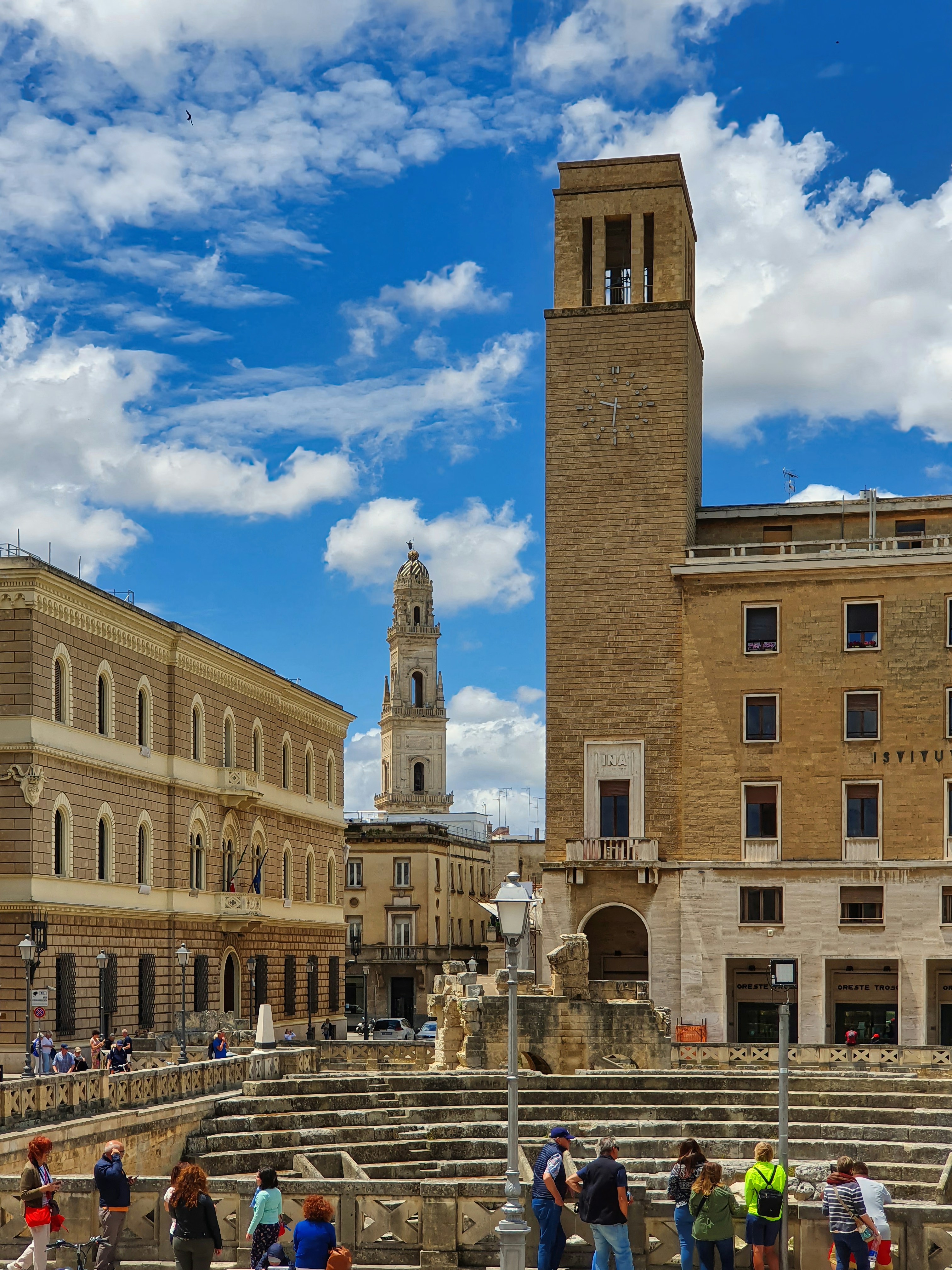 Urban Bell-Tower Corridor Under a Bright Italian Sky