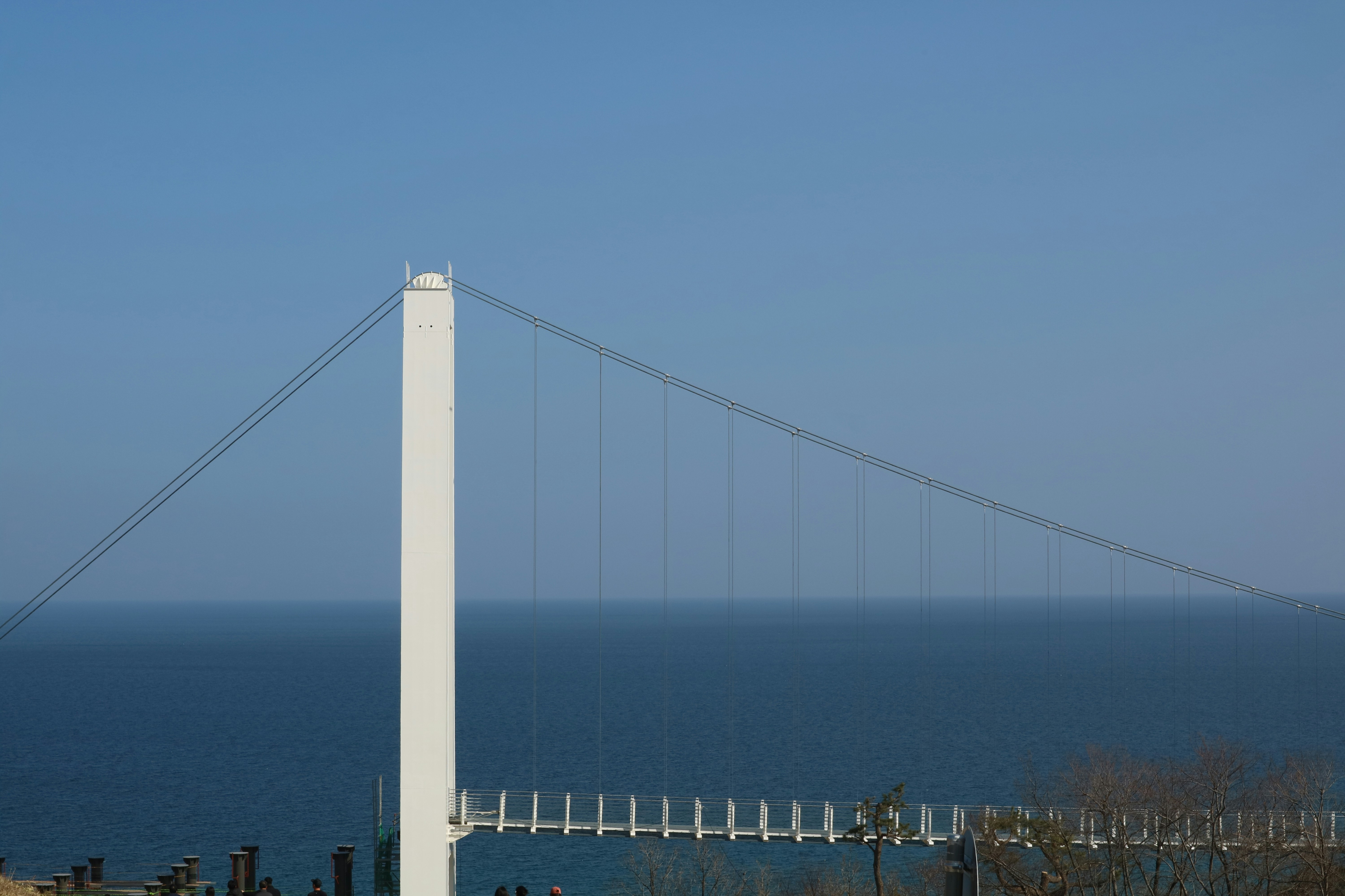 Ocean Span: A lone white pylon holds the horizon together