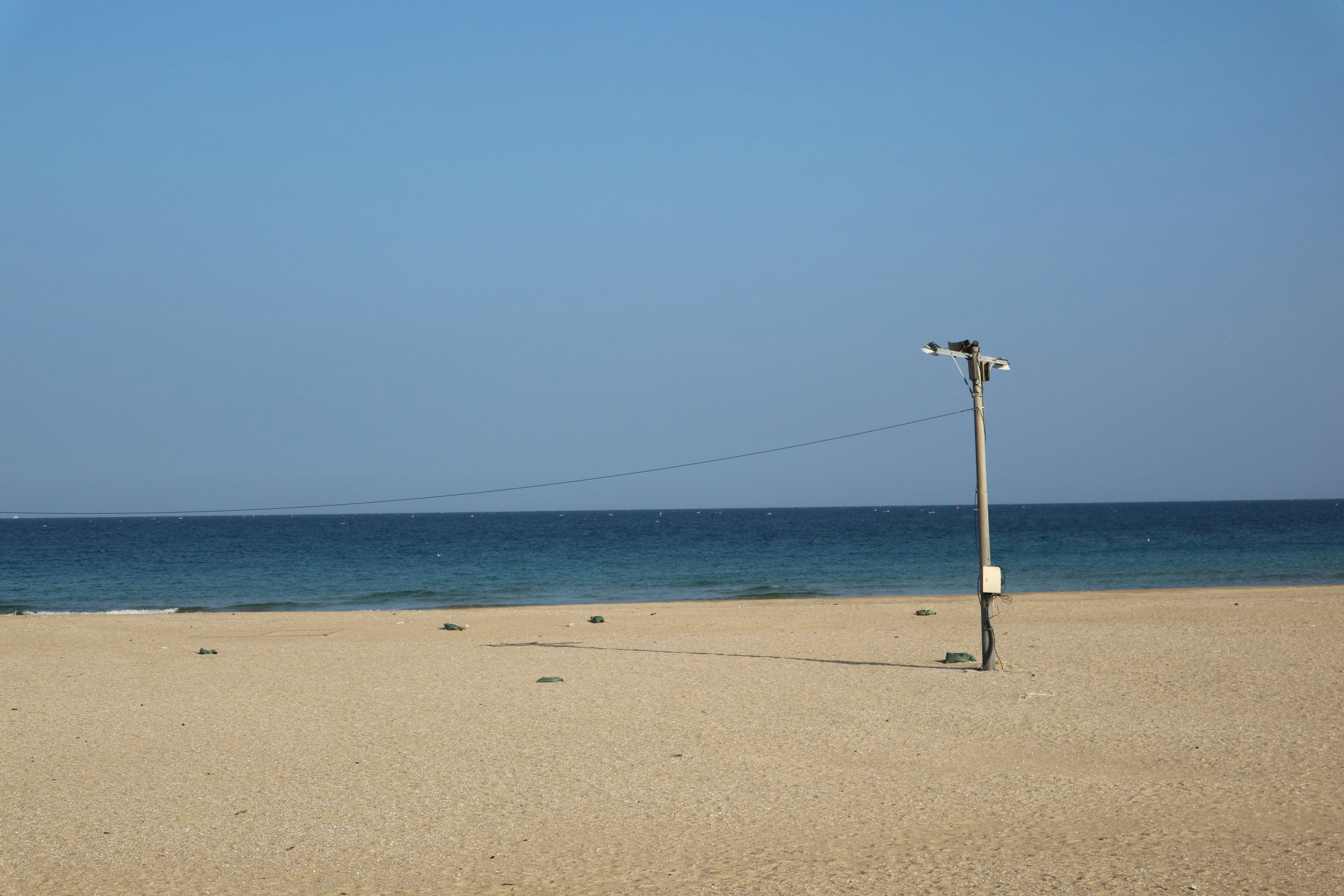 Lonely Power Line Reaching for the Sea