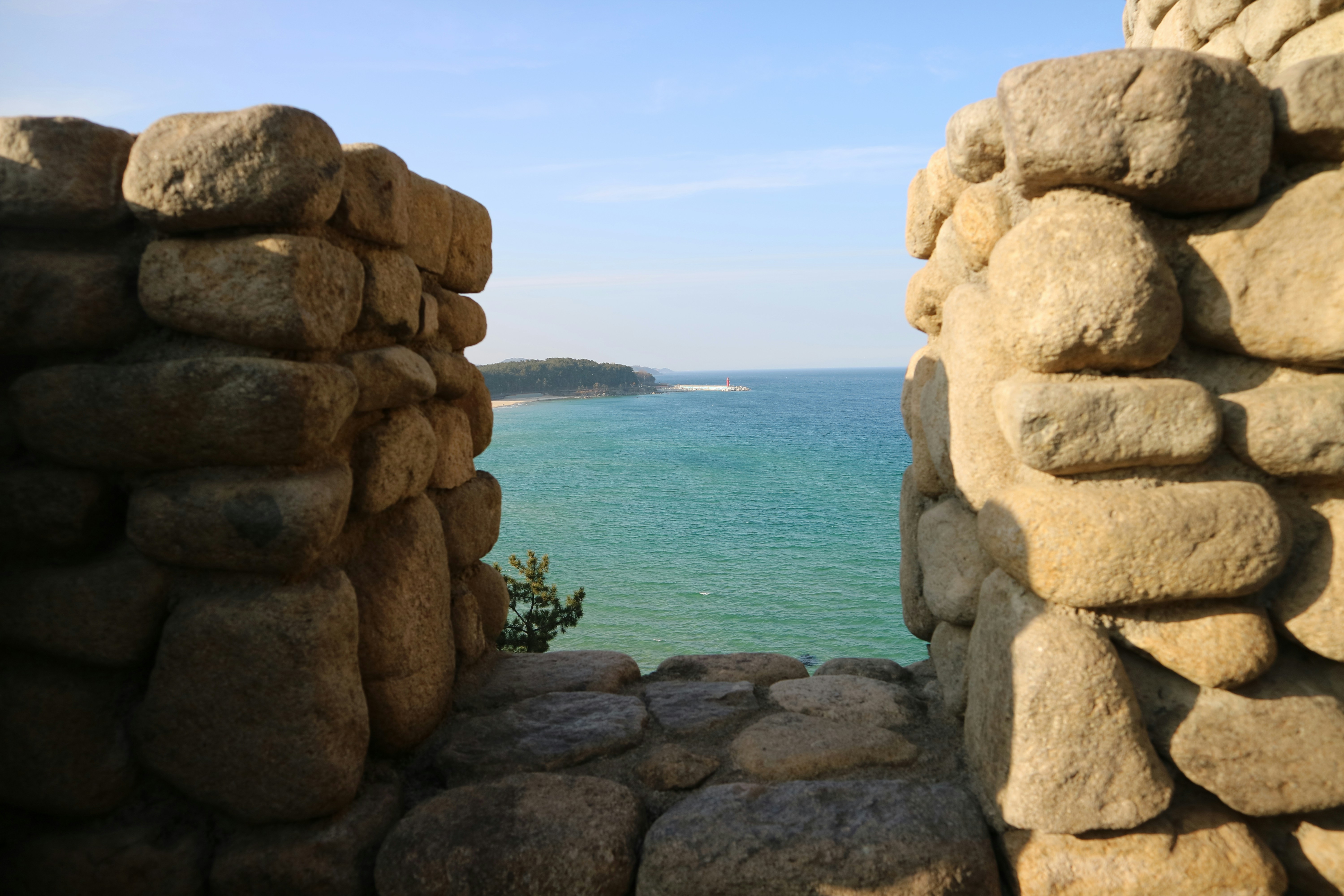 Sea Vista Framed by Ancient Stone Walls