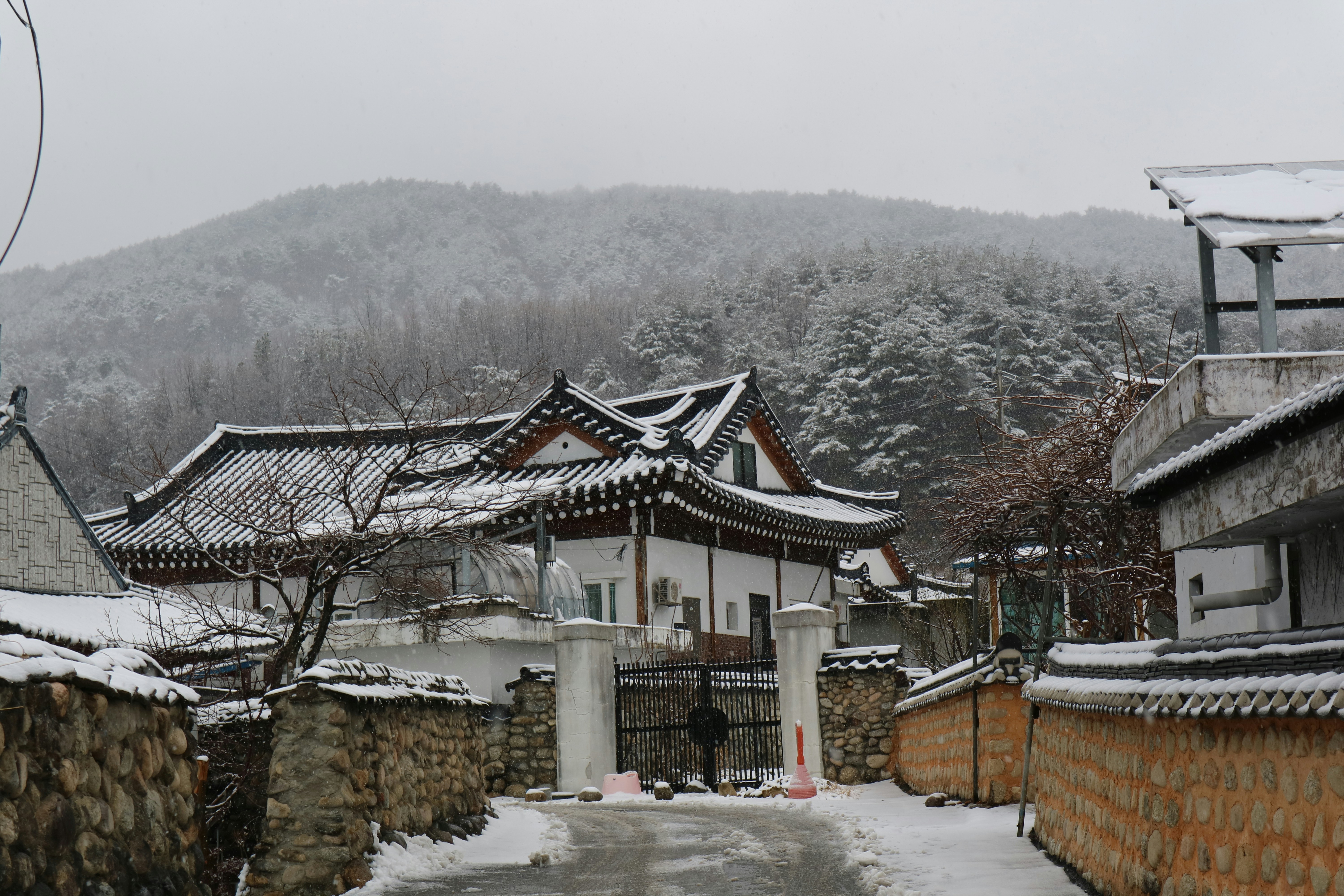 Snow-Blanketed Korean Village Gate