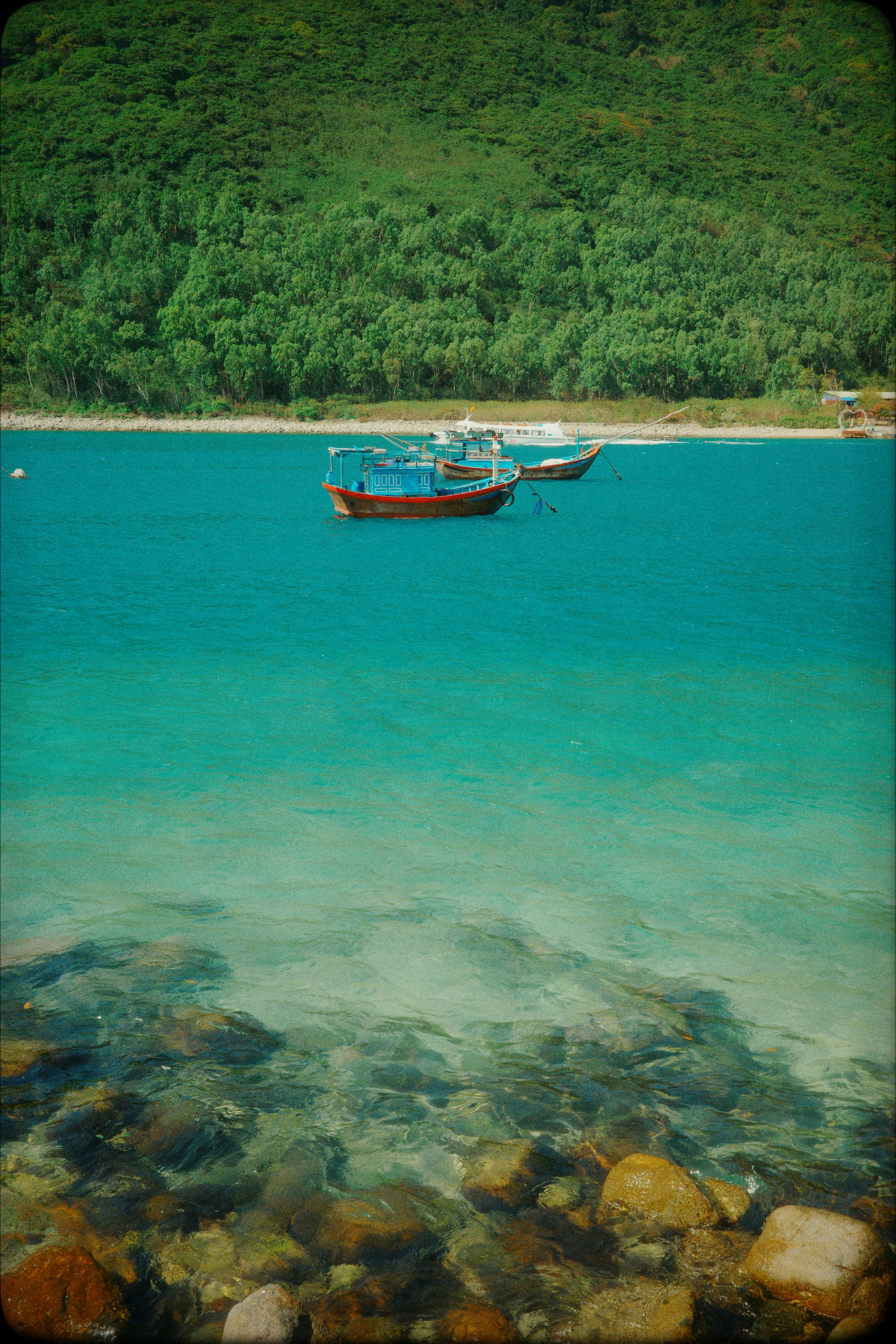 Azure Vessel at the Edge of a Turquoise Seascape