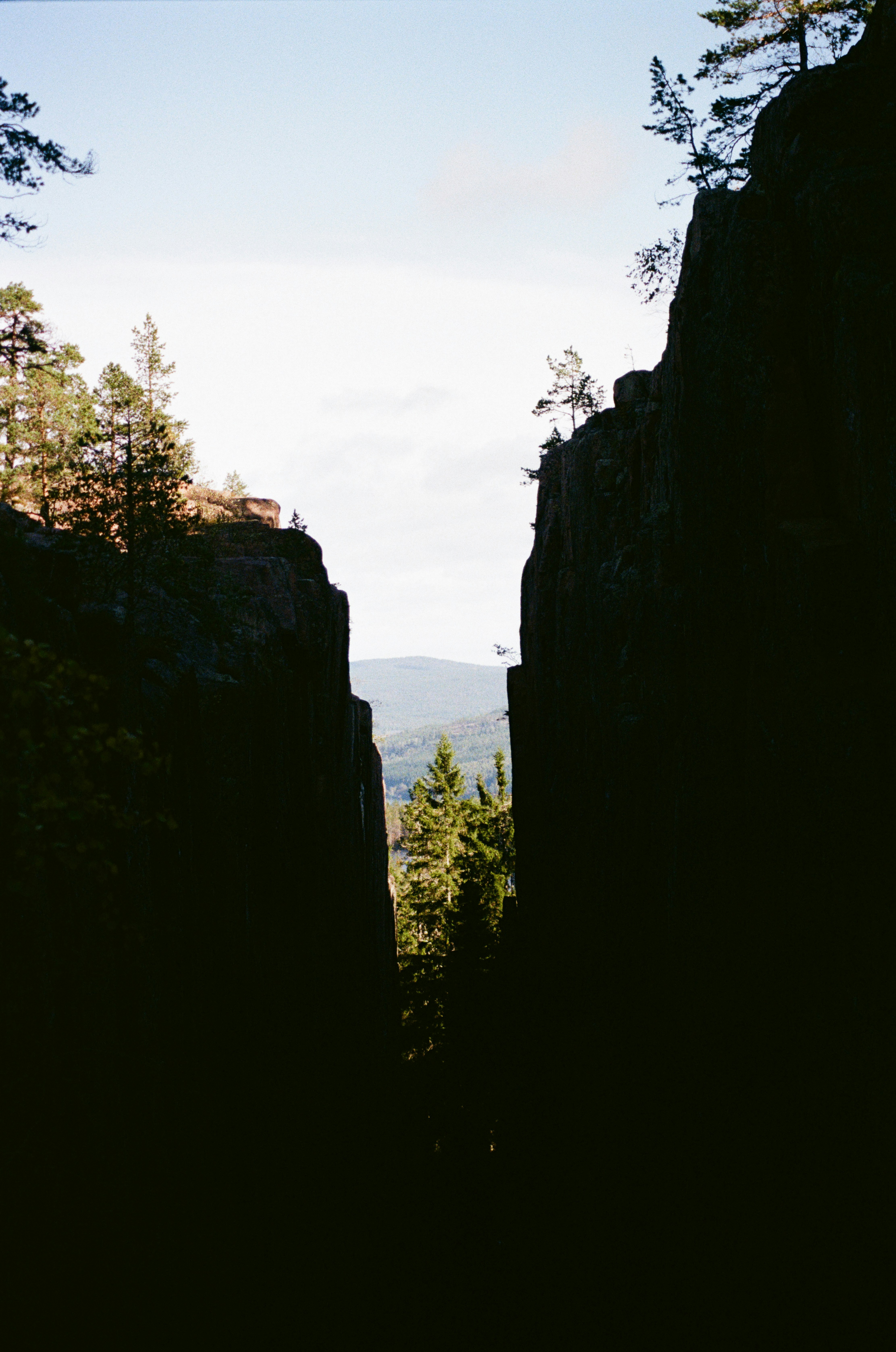 Chasm of Light: Narrow Gorge Toward Distant Valley