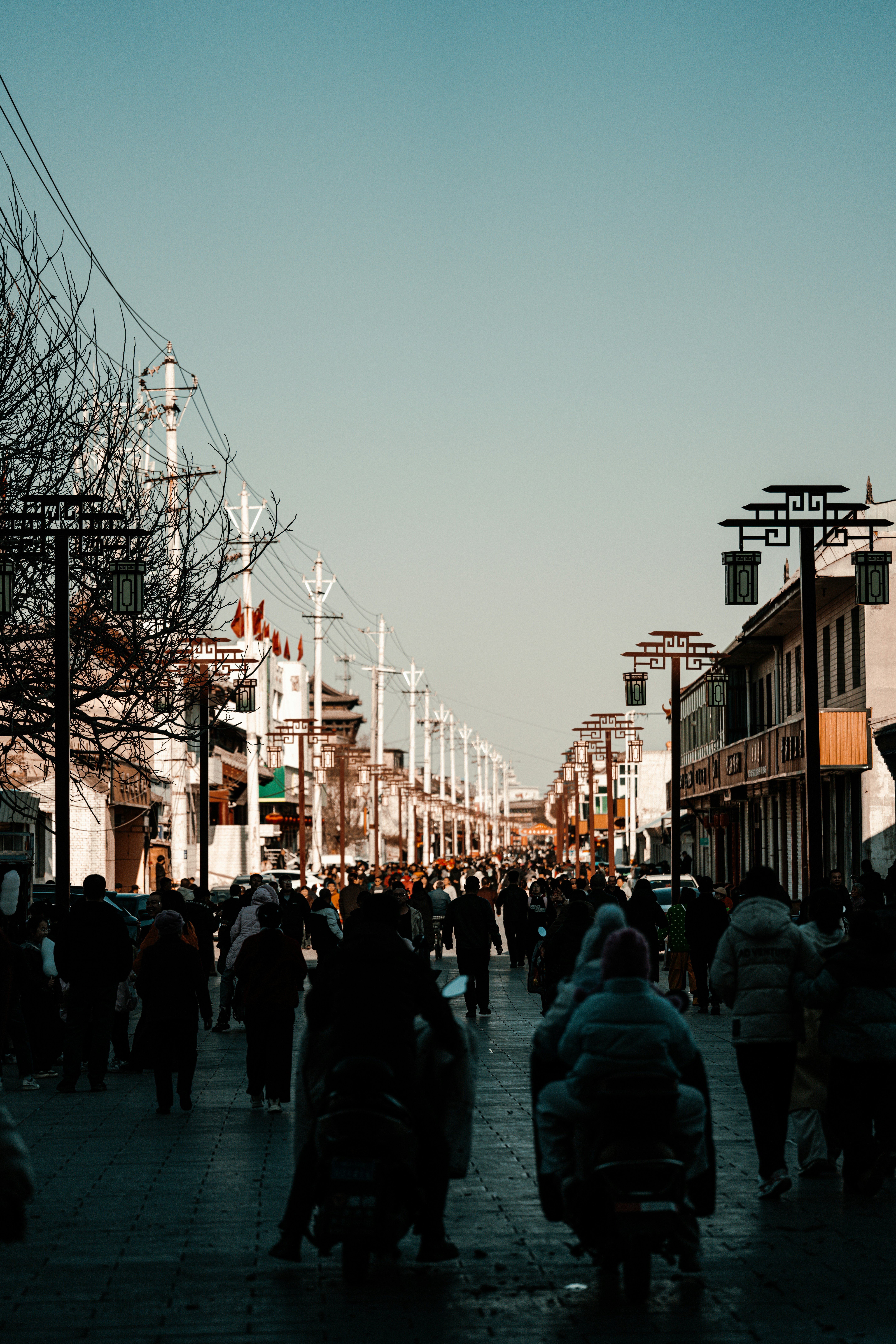 People-filled Avenue under Morning Light