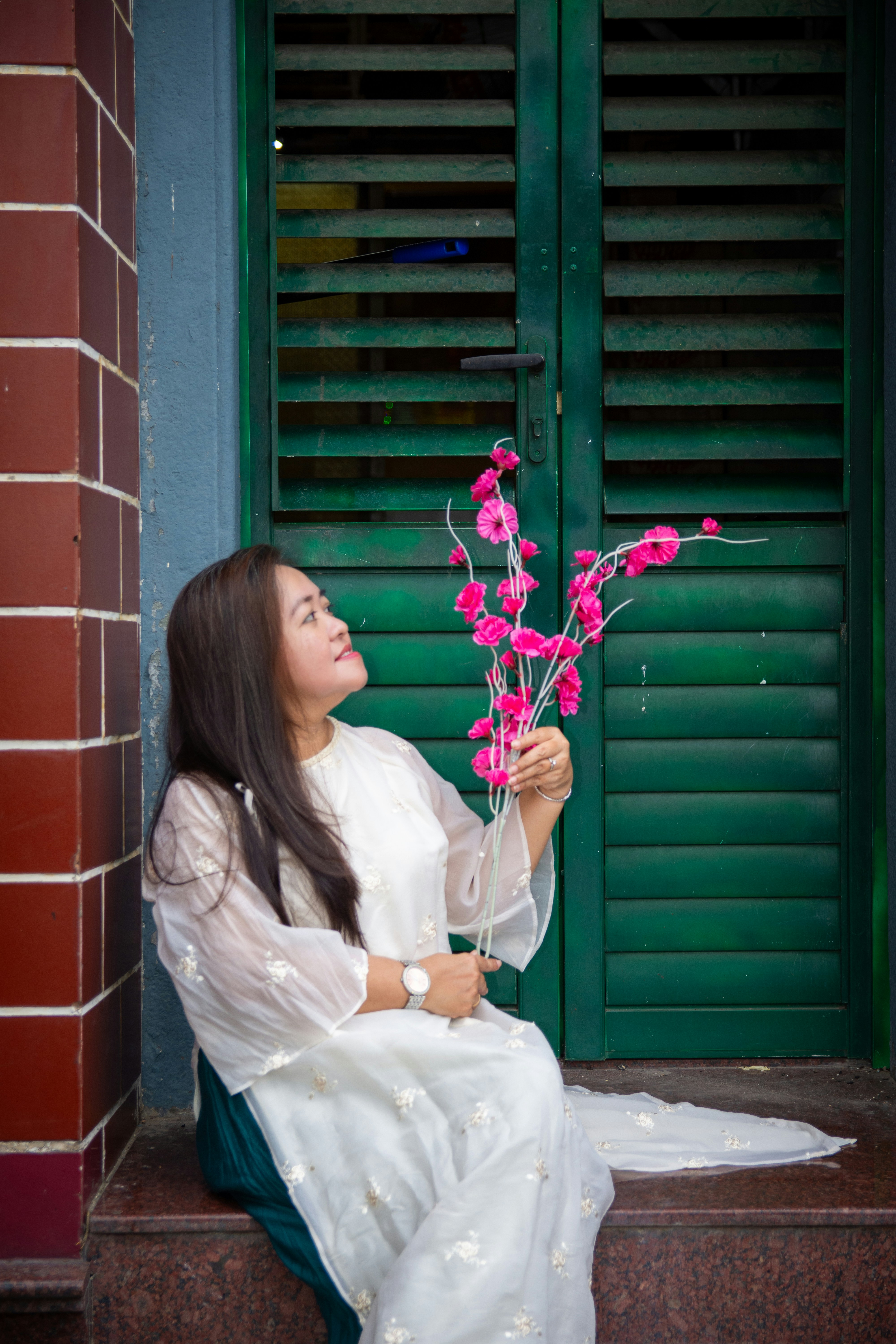 Floral Embrace by the Green Door