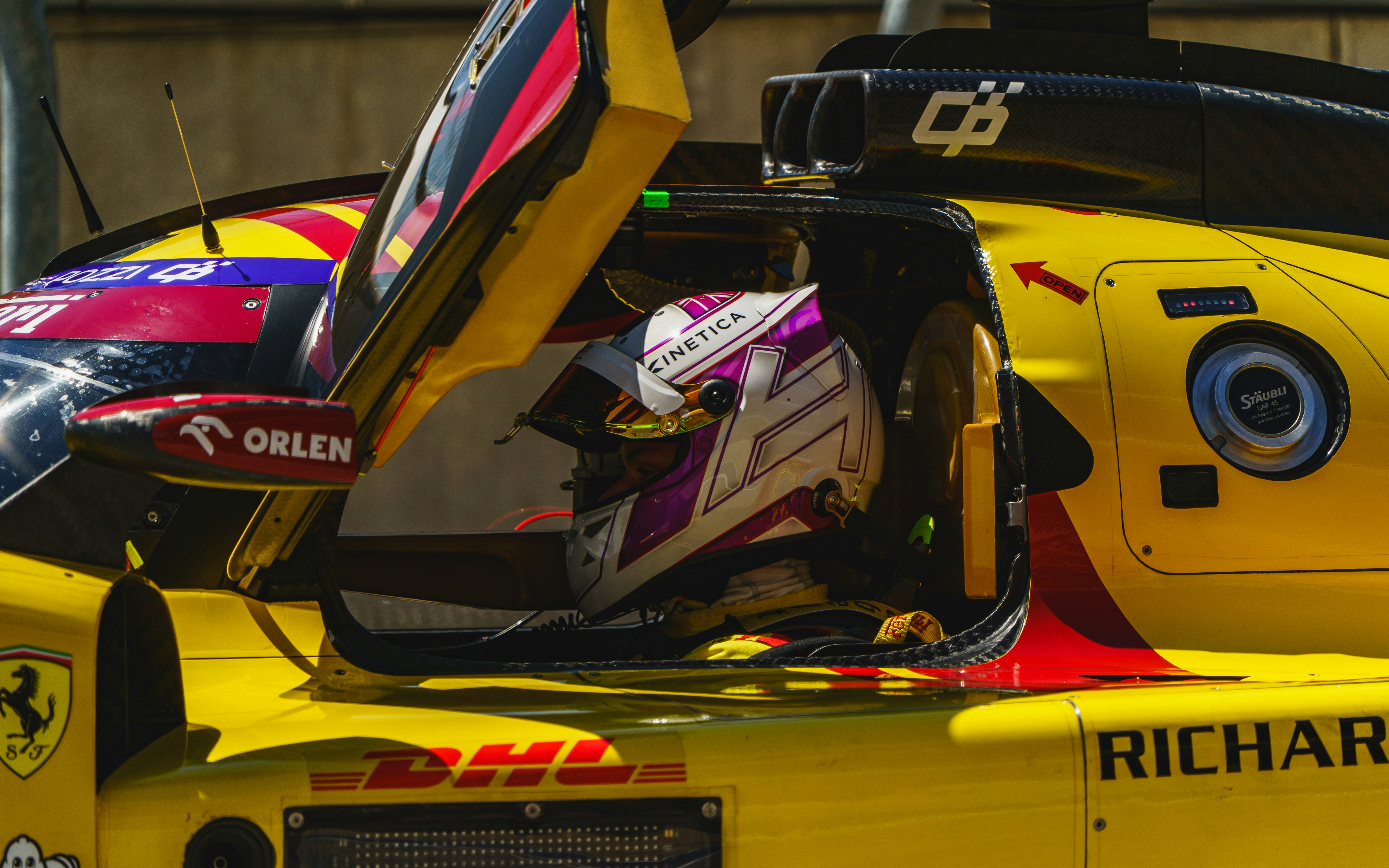 Cockpit Quiet: A Racer Ready in the Yellow Jaguar