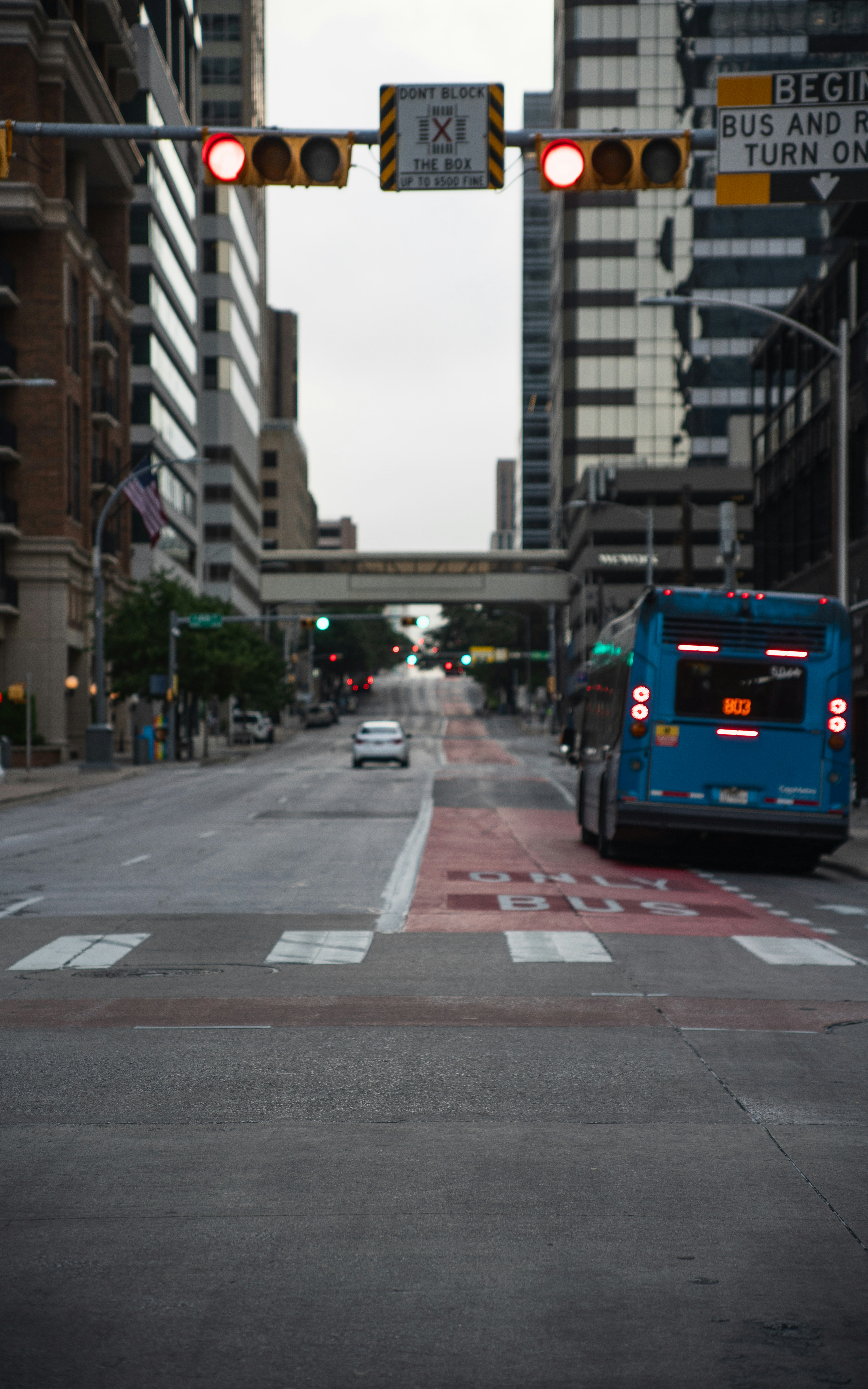 Blue Bus in a Quiet City Corridor