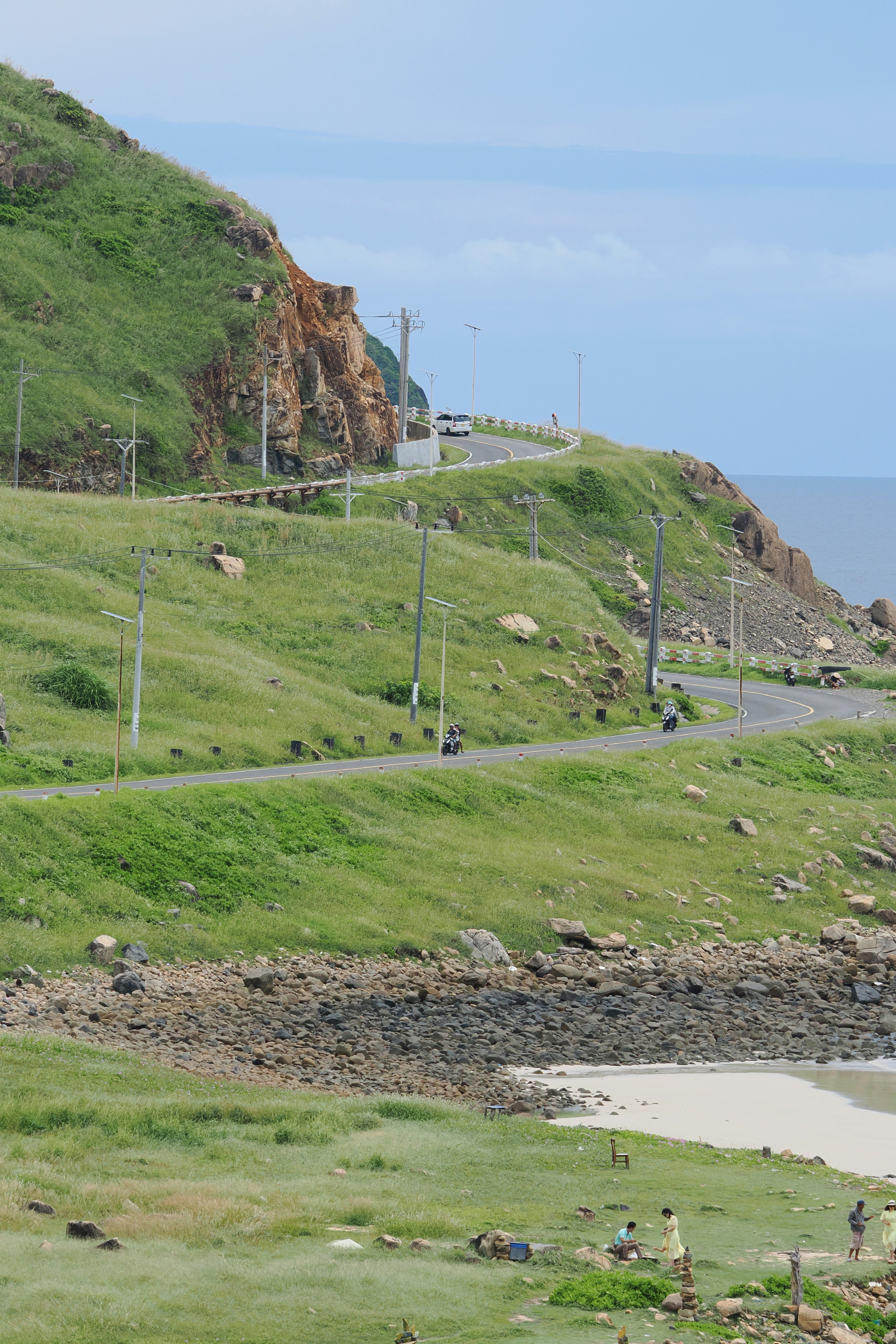 Coastal Ribbon: A Winding Road Clings to Verdant Cliffs