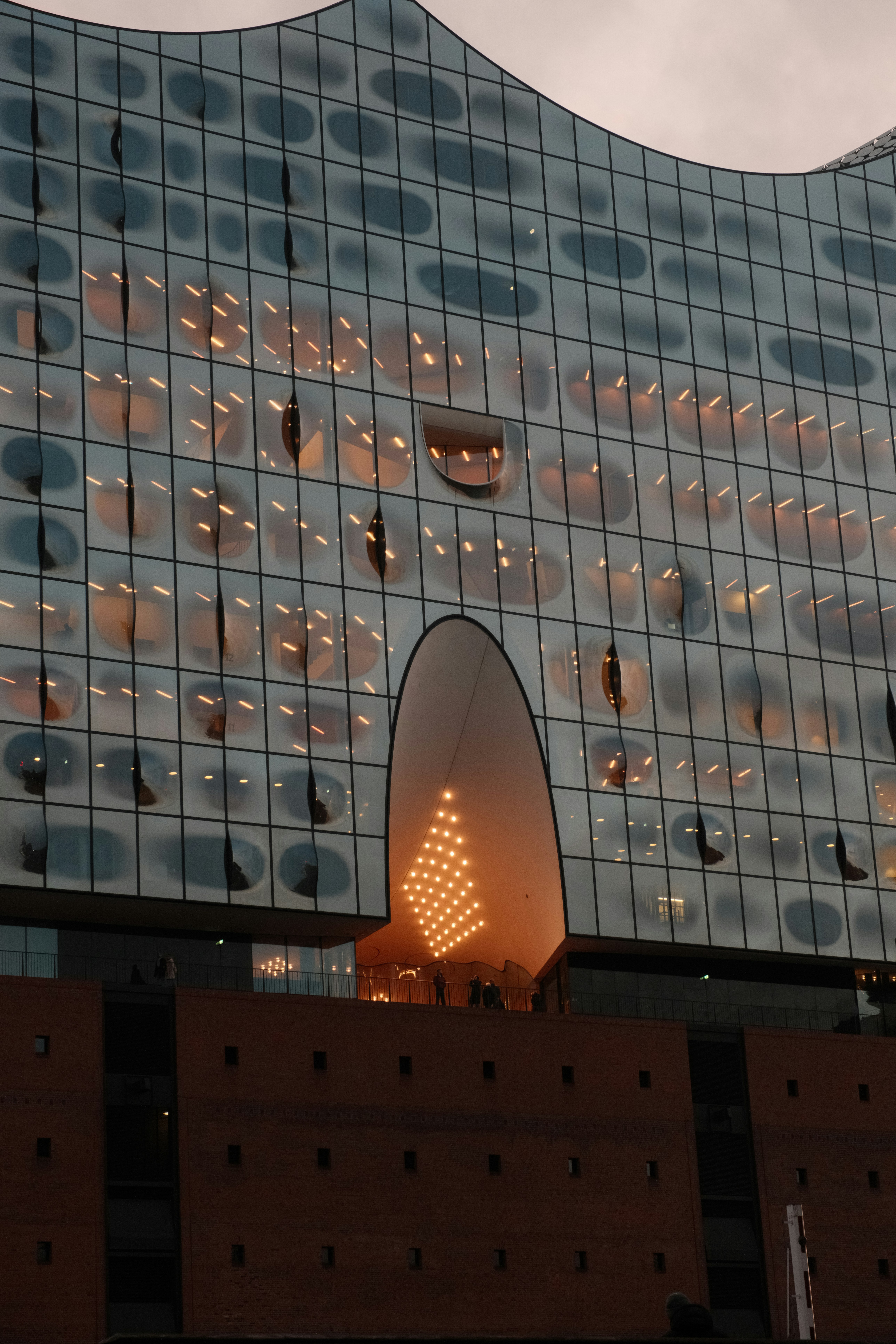 Glass Facade Echoes: Hidden Choir of Warm Light