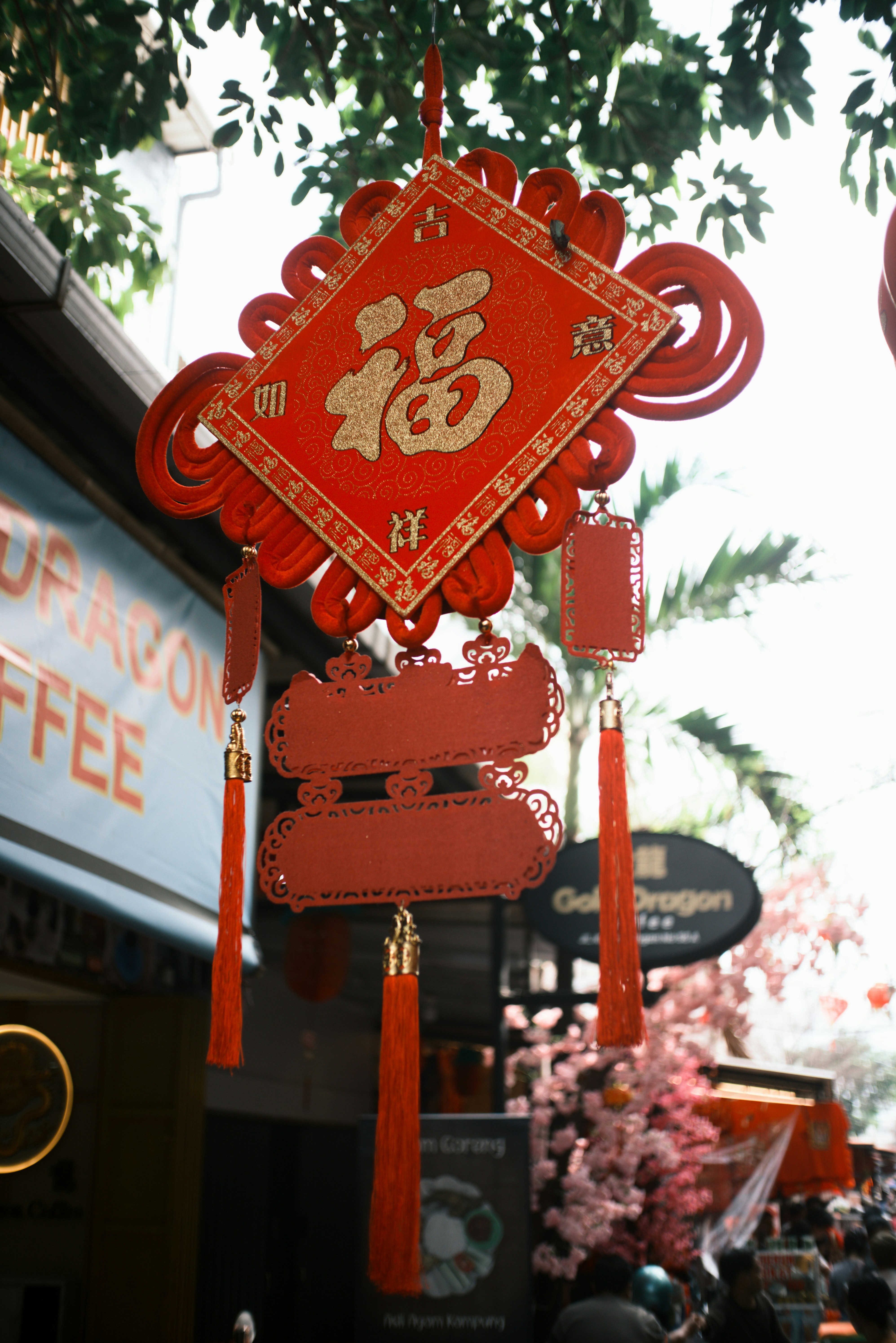 Red Diamond Lantern: Festive Symbol Hanging Over a Bustling Street