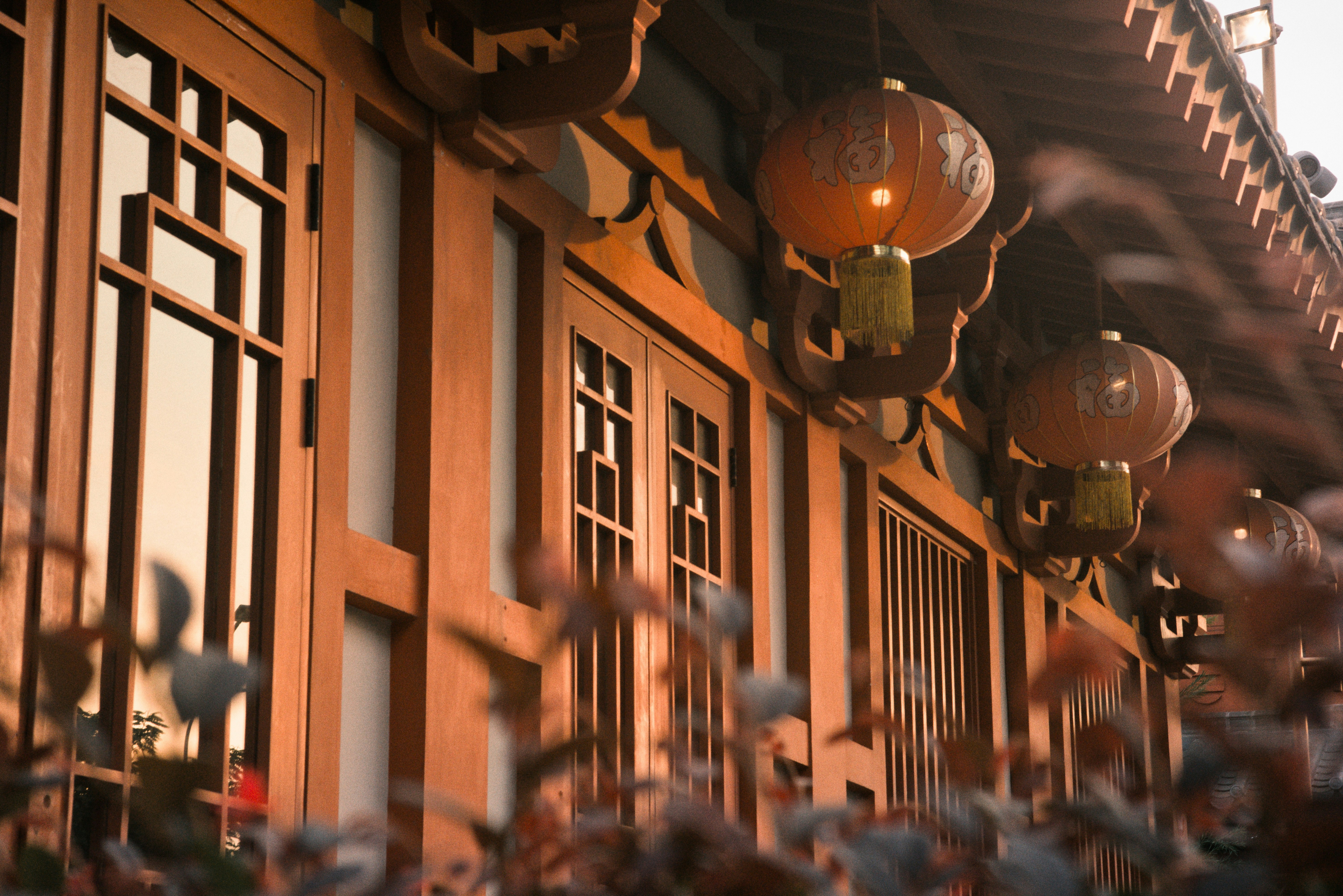 Lanterns and Lattice: Evening Facade of a Traditional Corridor