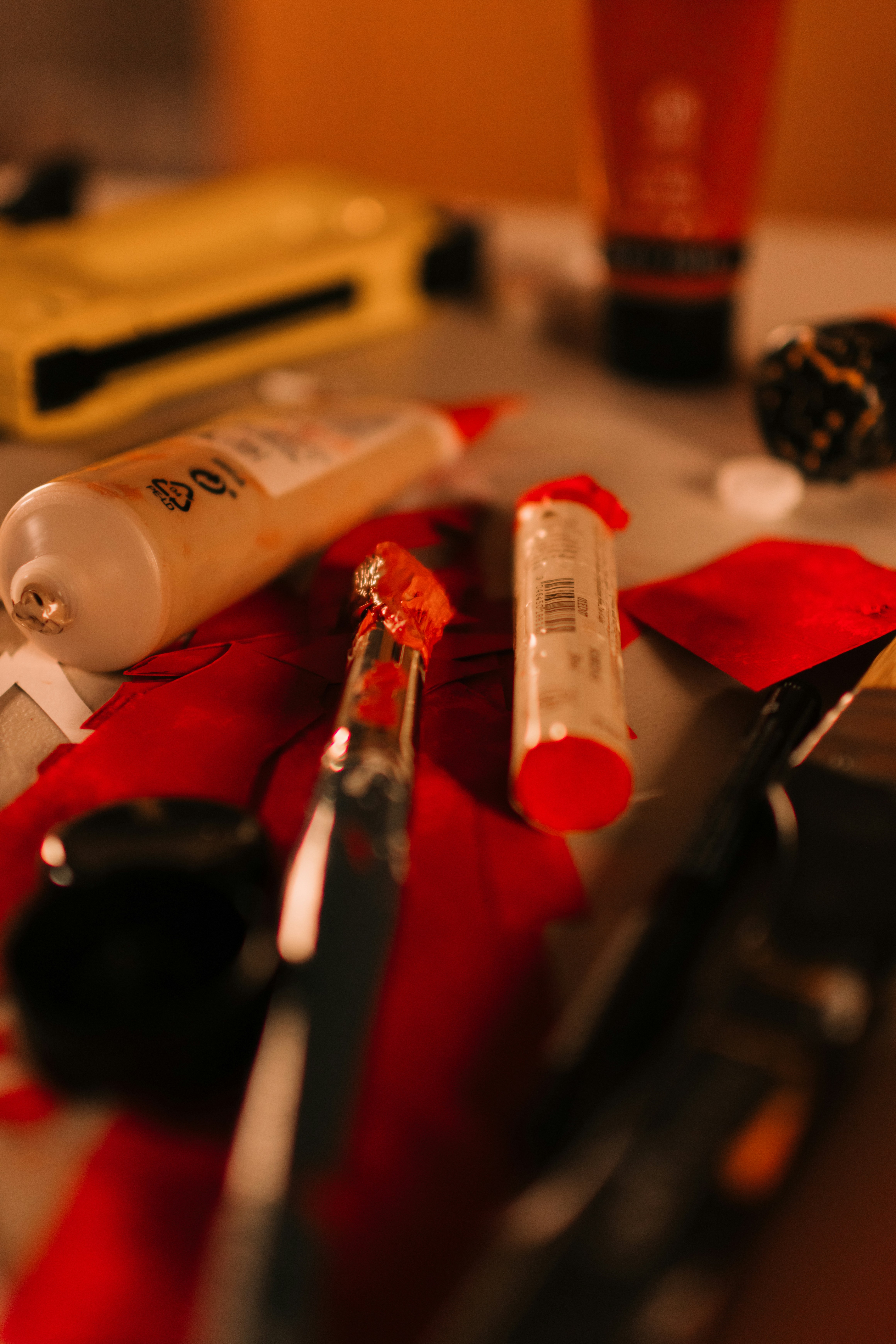 Brushes, Tubes, and Red Confetti: A Quiet Studio Moment