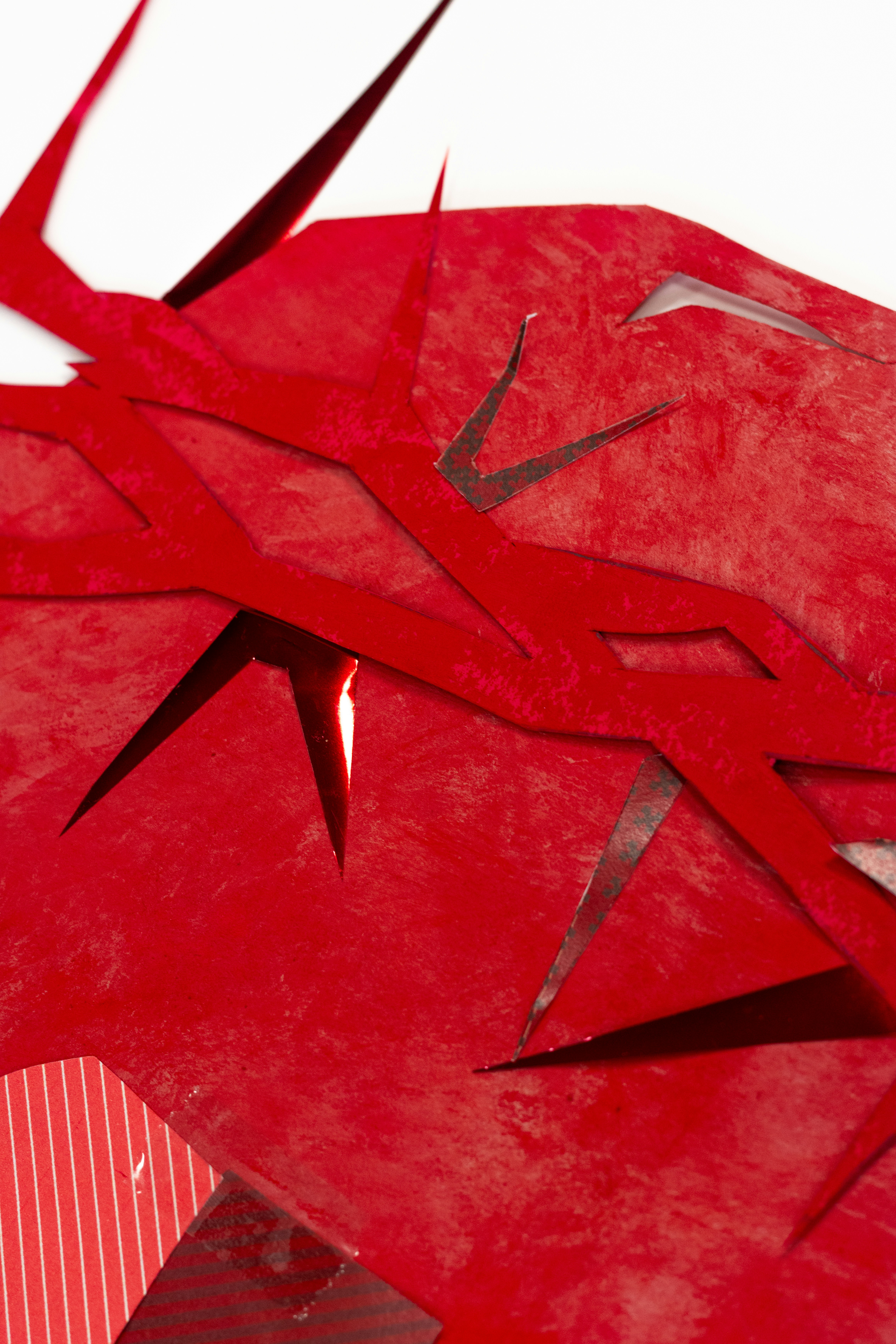 Red Fragmented Geometry: A Sharp Cut Through Paper Delusions