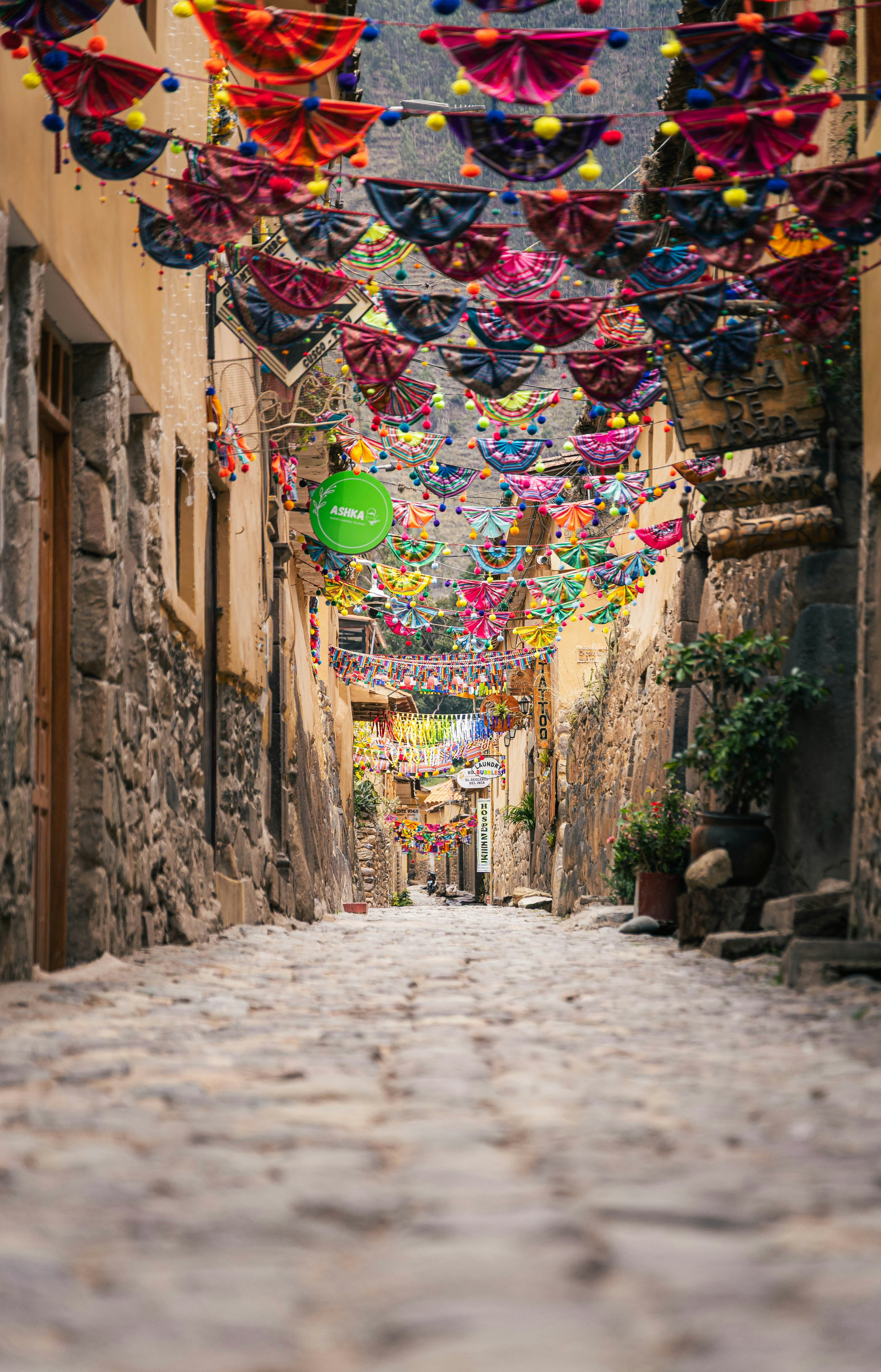 Colorful Umbrella Alley: A Cobbled Lane of Festive Canopies