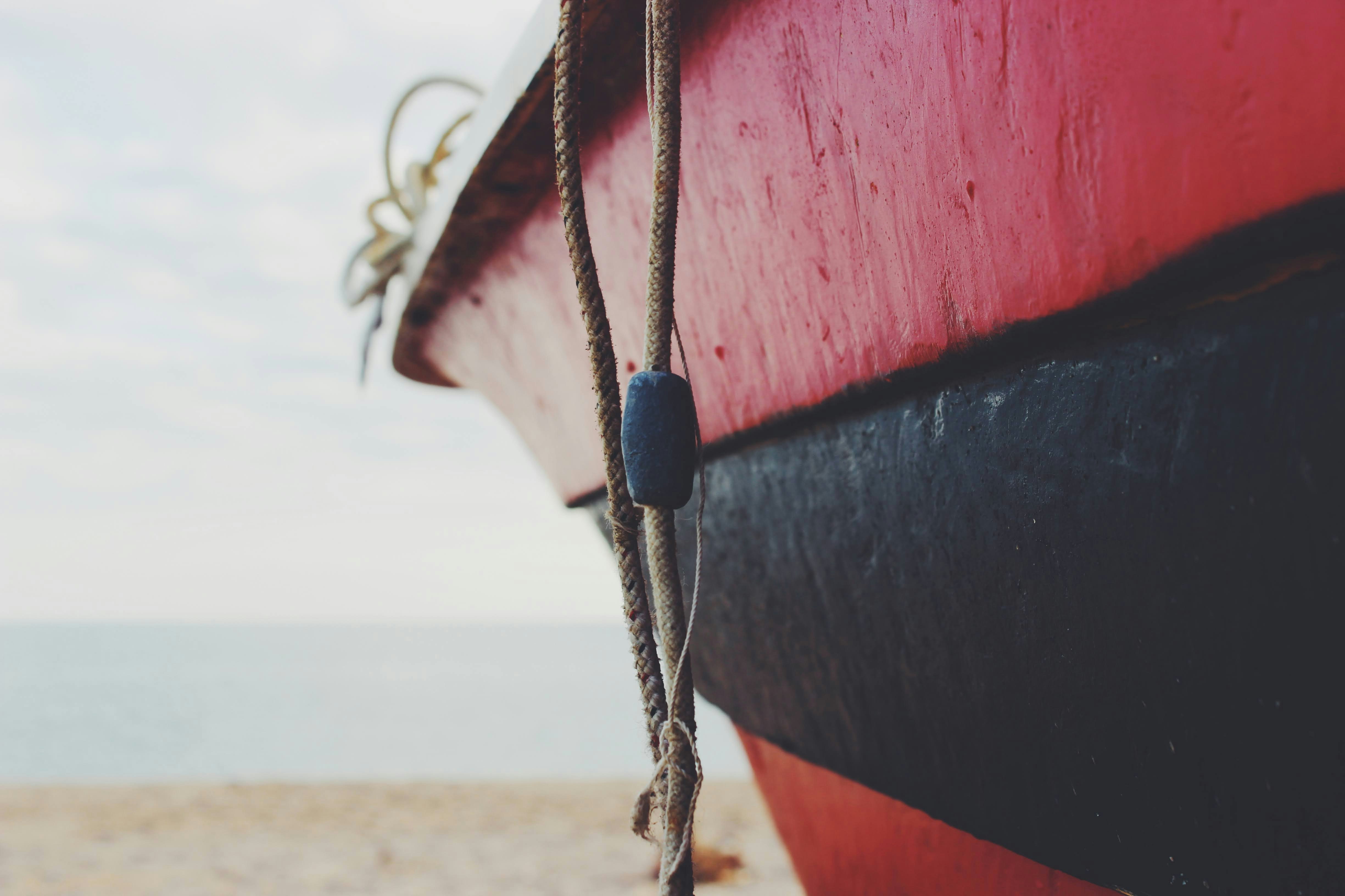 Red Hull, Blue Rope: A Quiet Moment on the Shore