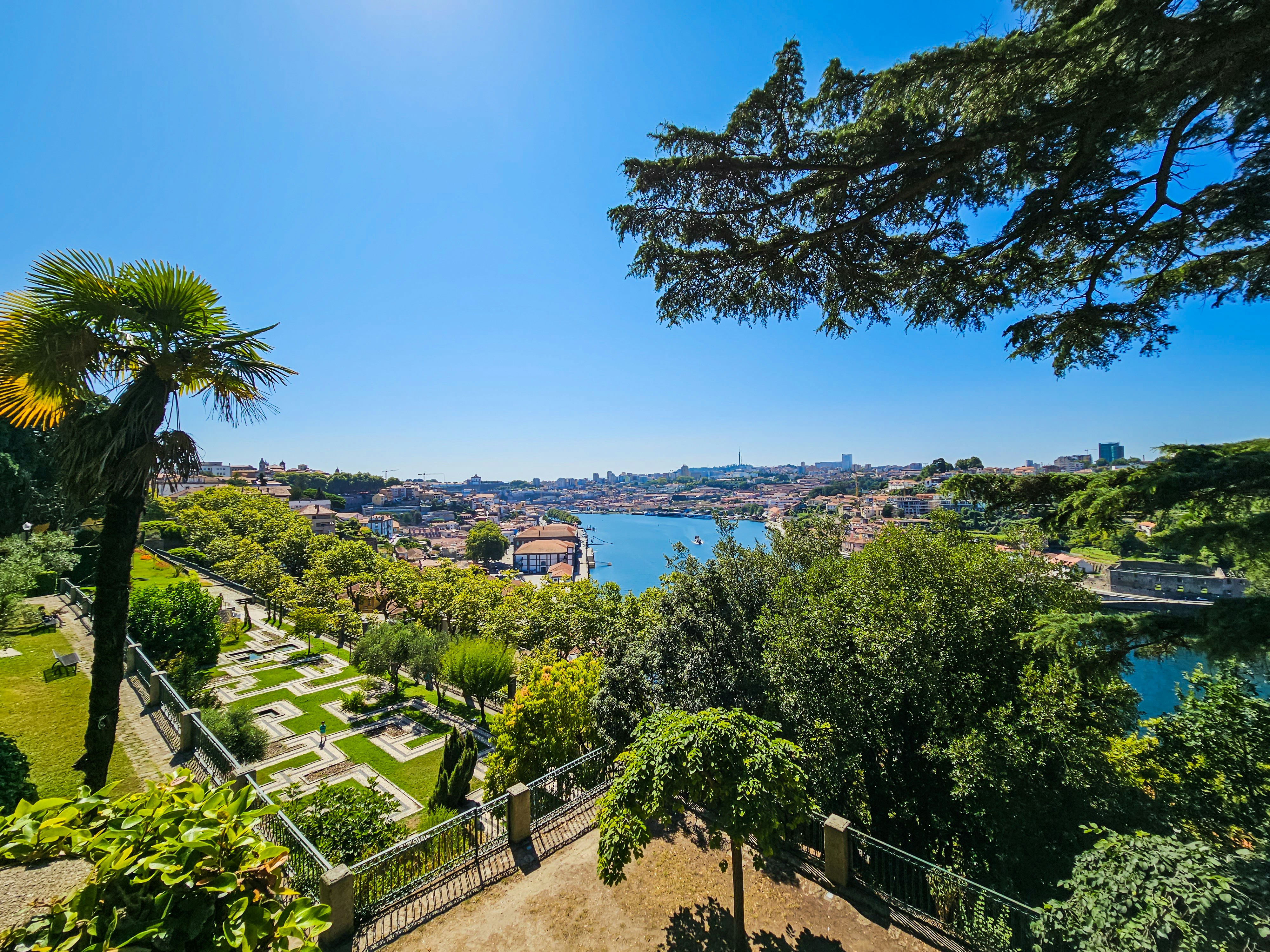 Sunlit Terrace Overlooking a Verdant Coastal Town