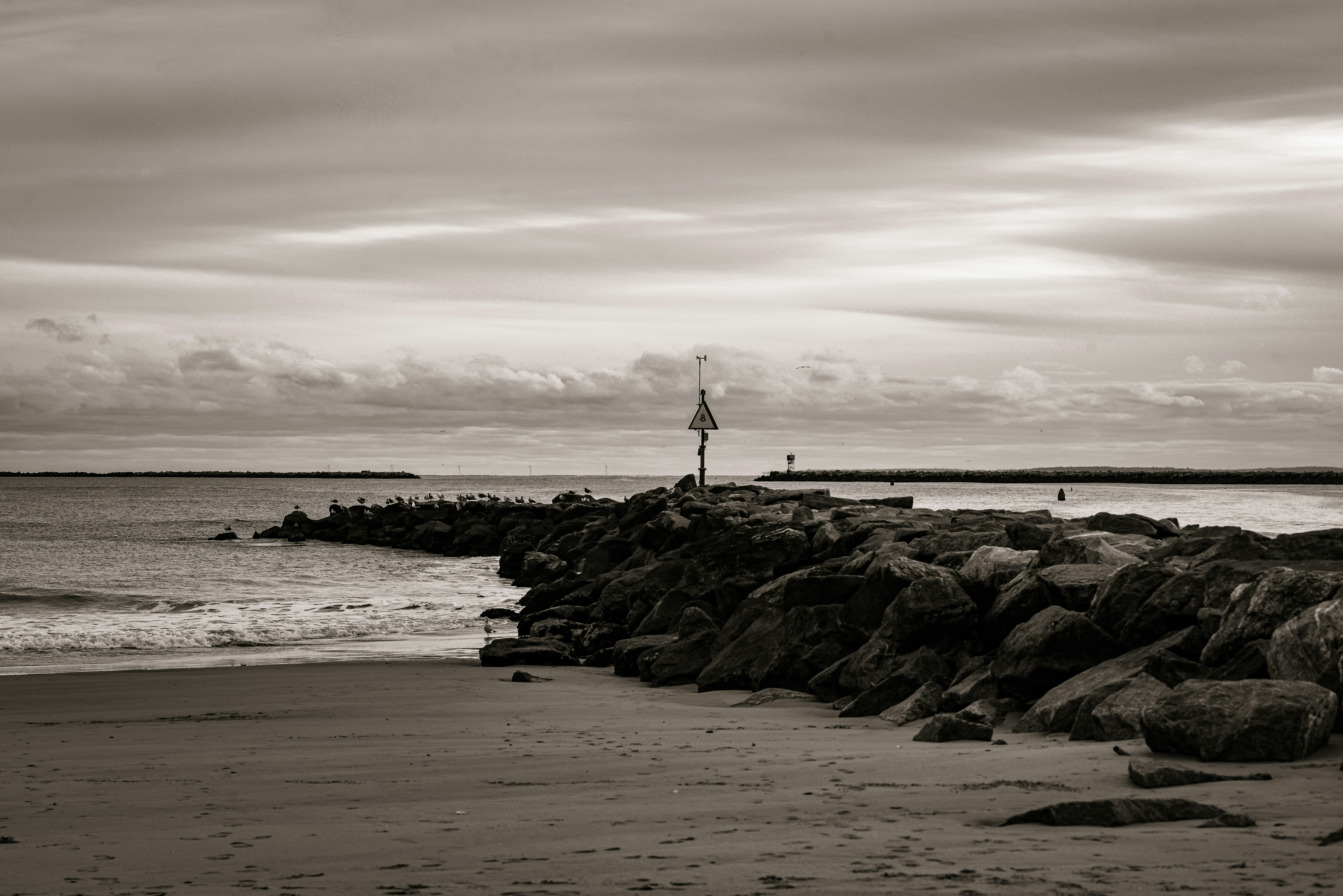 Lonely Breakwater at Dusk: A Quiet Maritime Promise