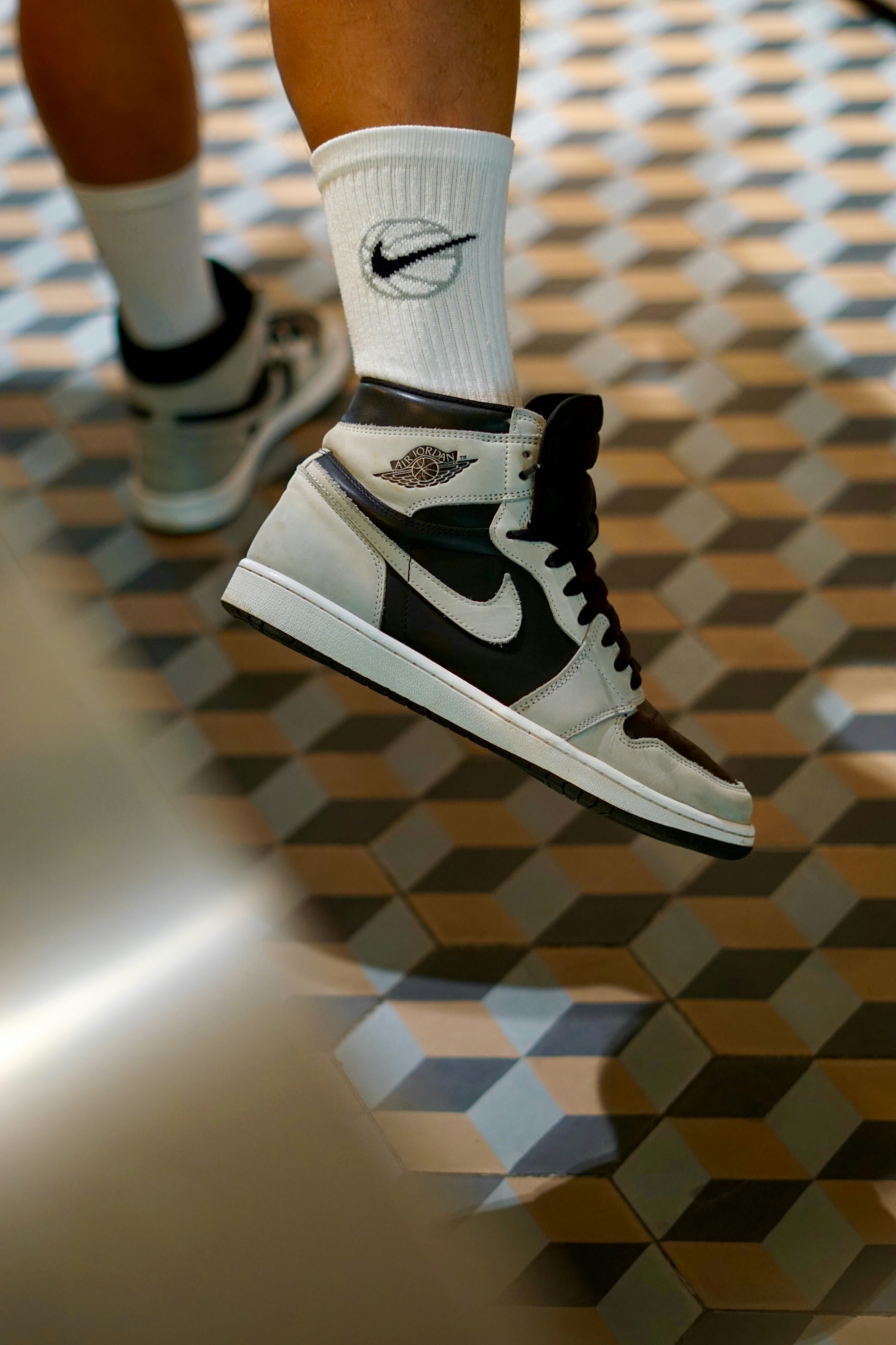 Airborne Kicks: Jordan silhouette in a checkered glow