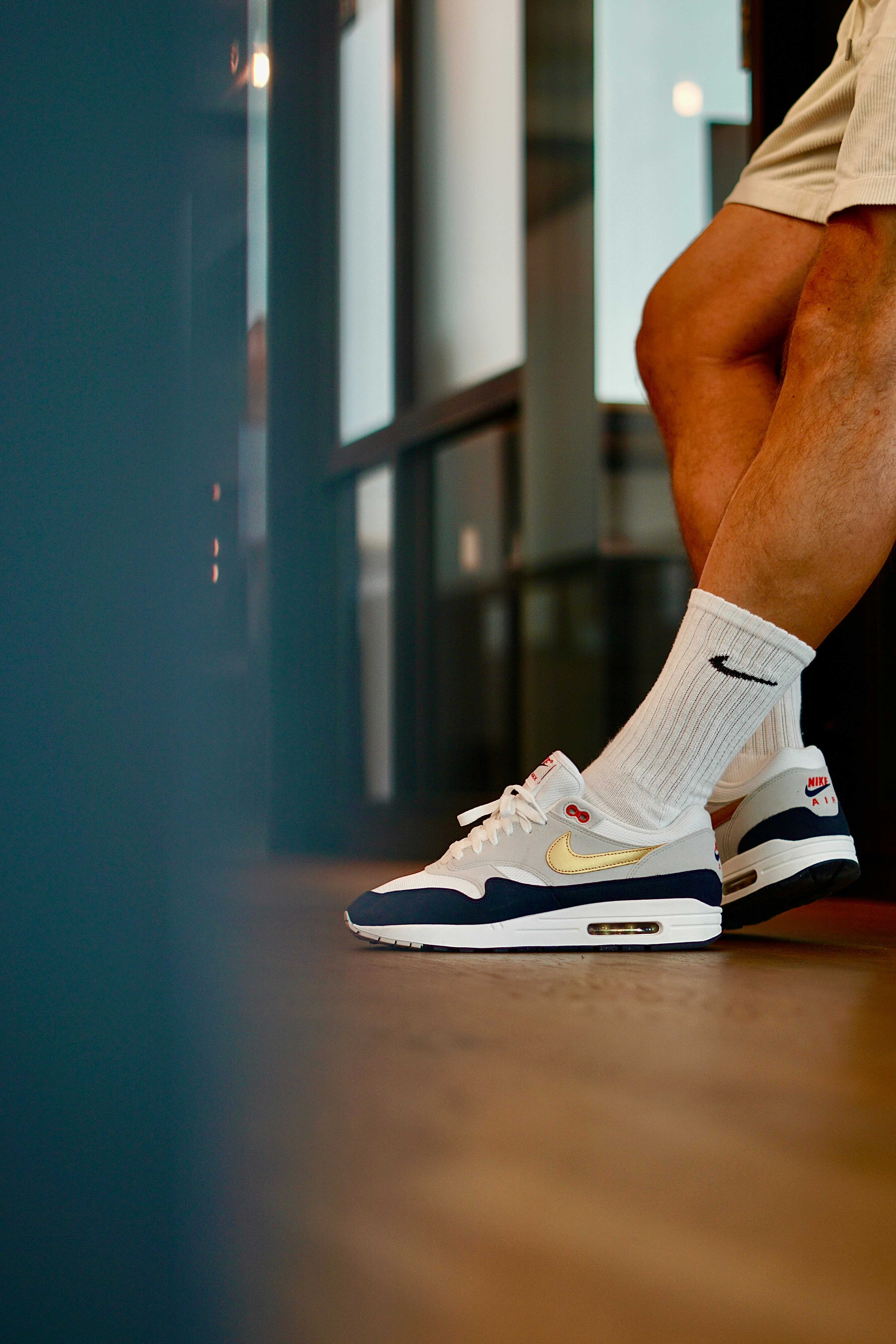 Stride in Front of Glass: A Runner's Moment in the Gym