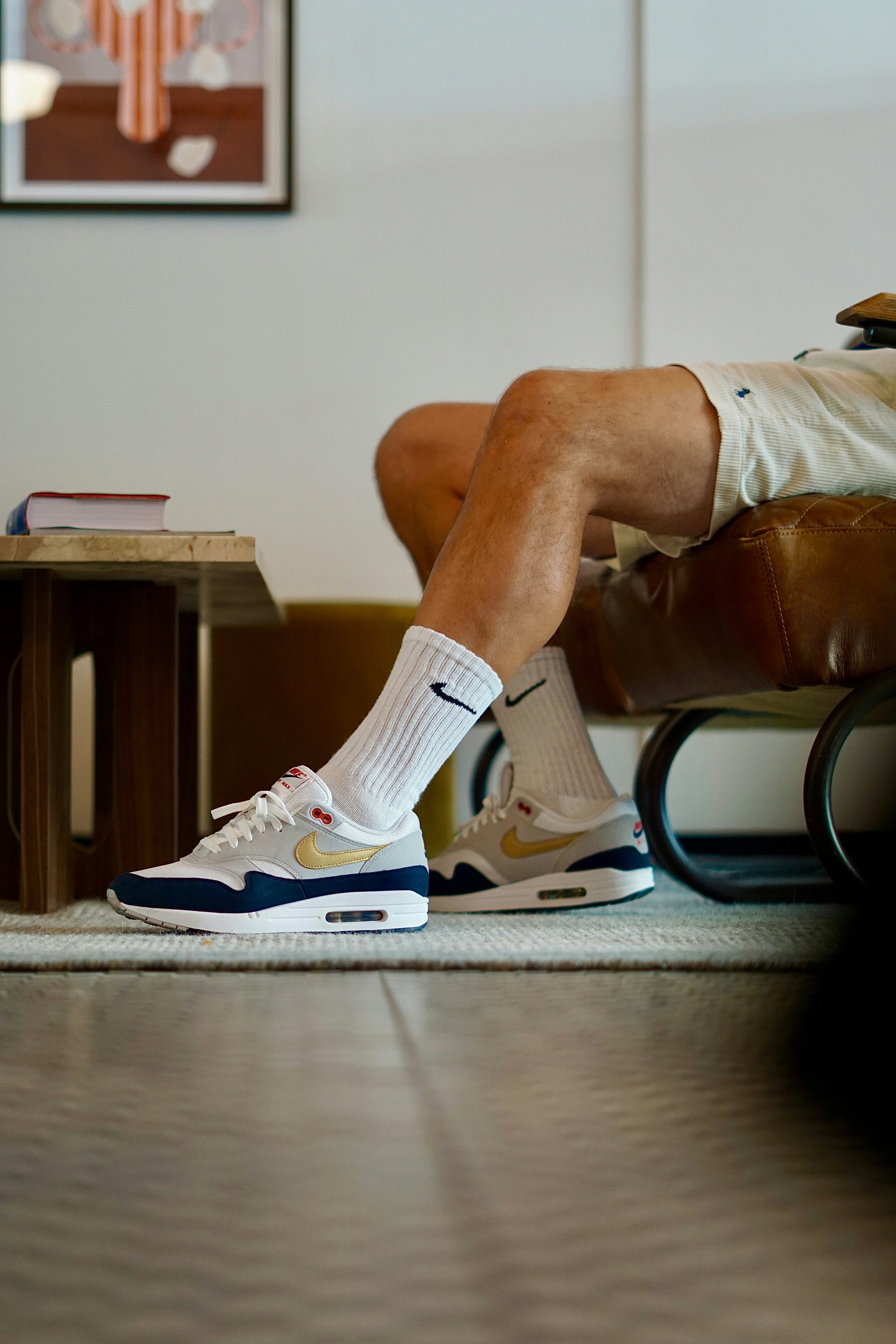 Low-slung sneakers at rest: a casual indoor moment