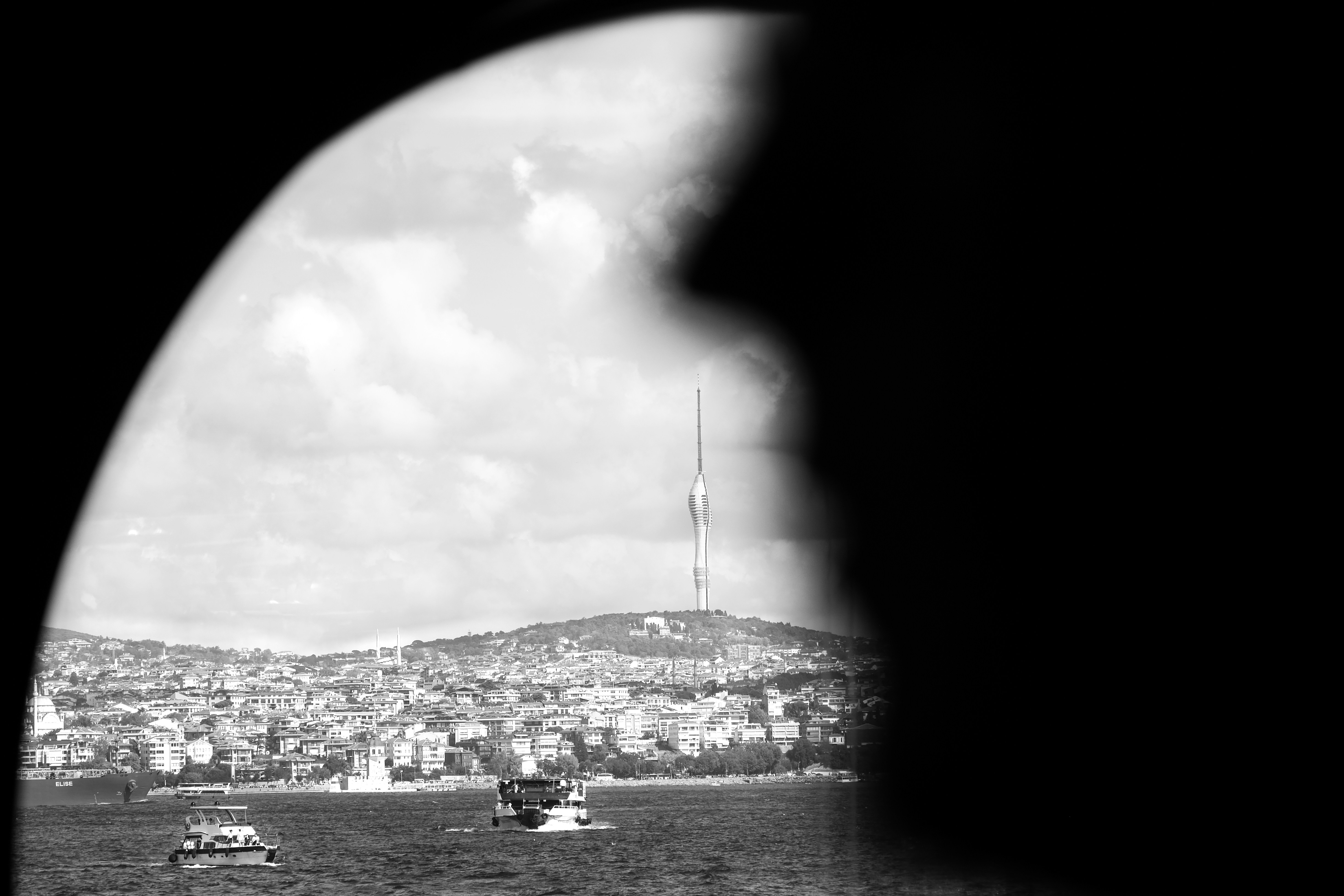 Shadowed View Through a Folded Frame over a Coastal City