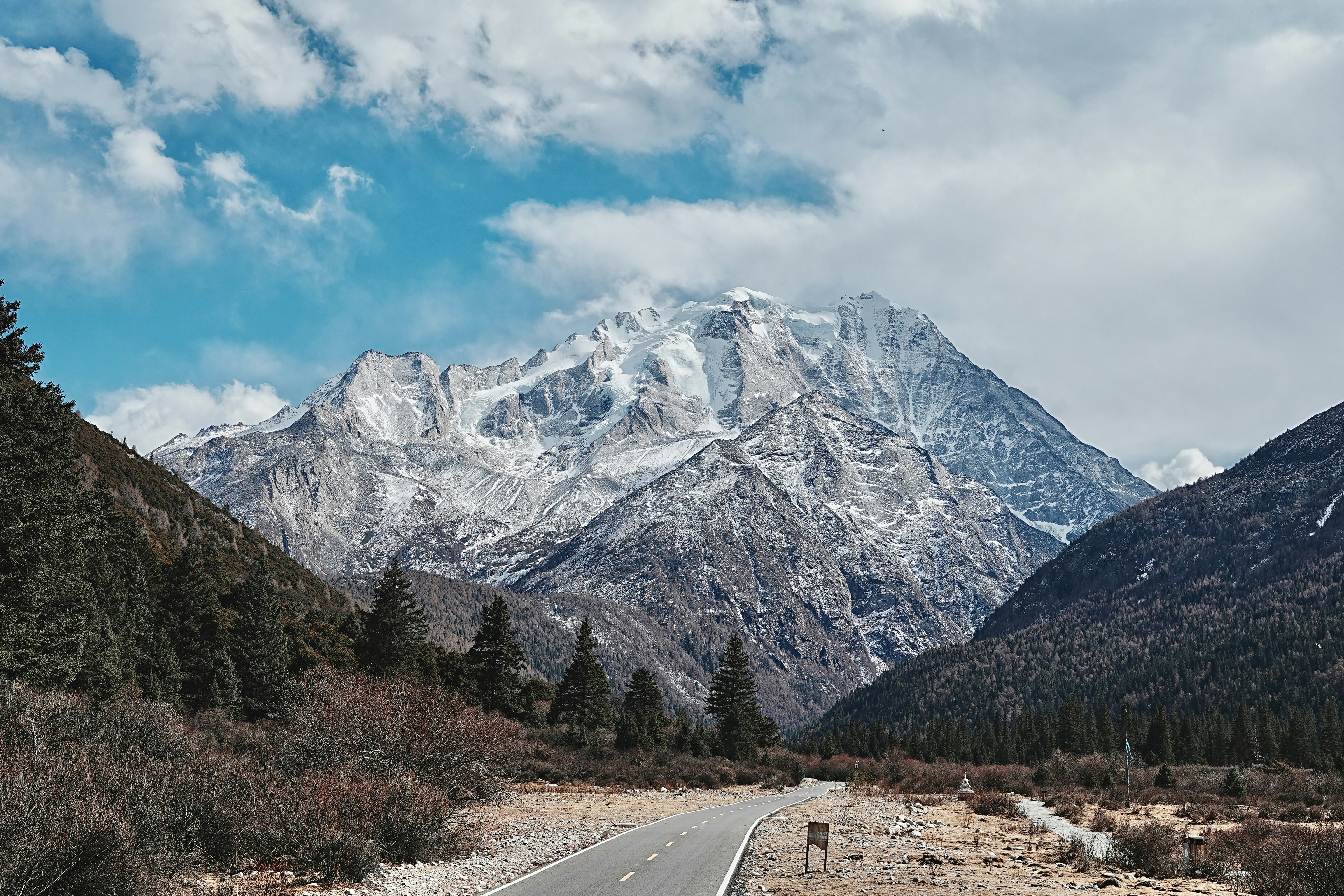 Toward the Snow-Capped Summit on a Deserted Highway