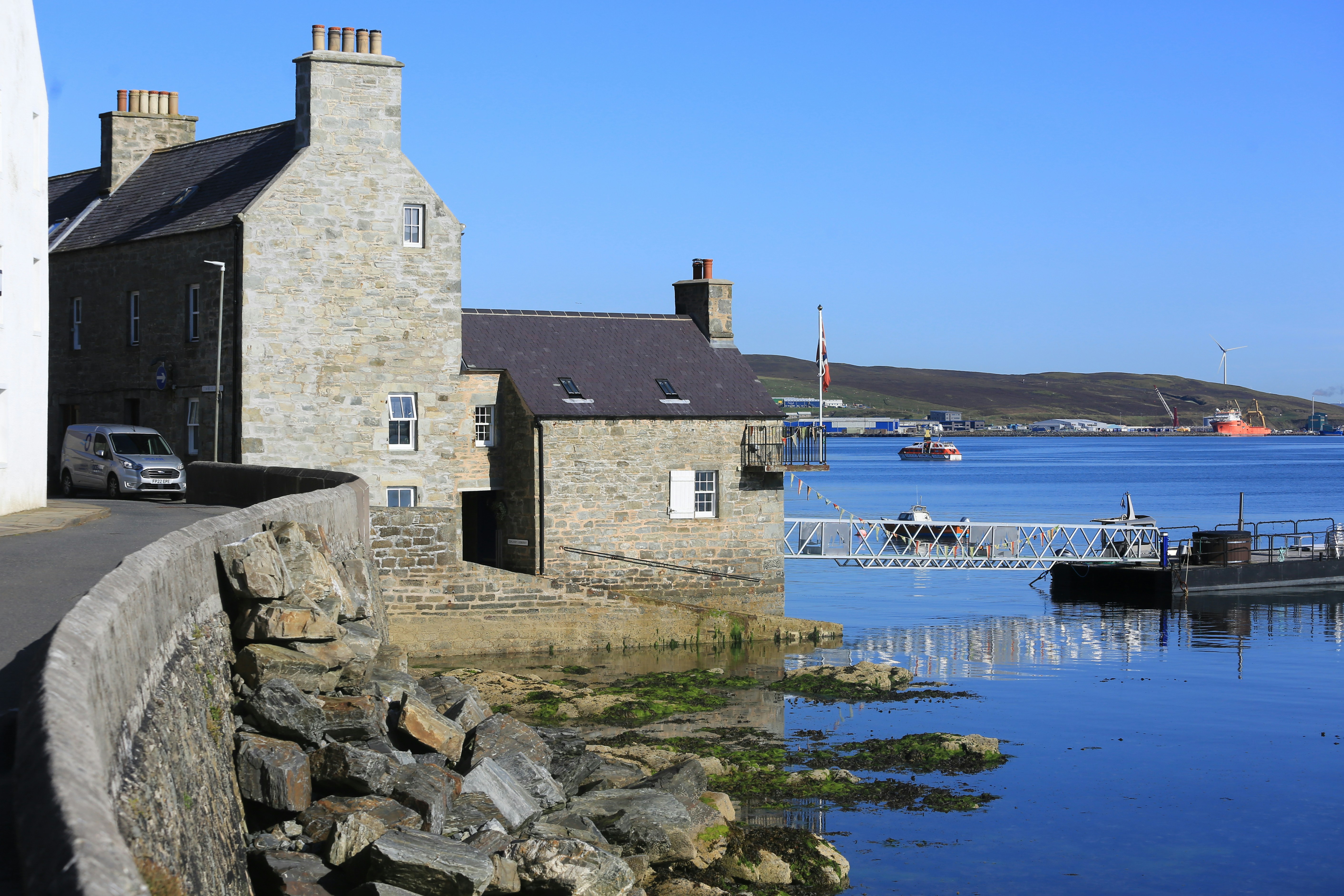 Stone Quay at Dusk: A Harbour town anchored by rugged walls