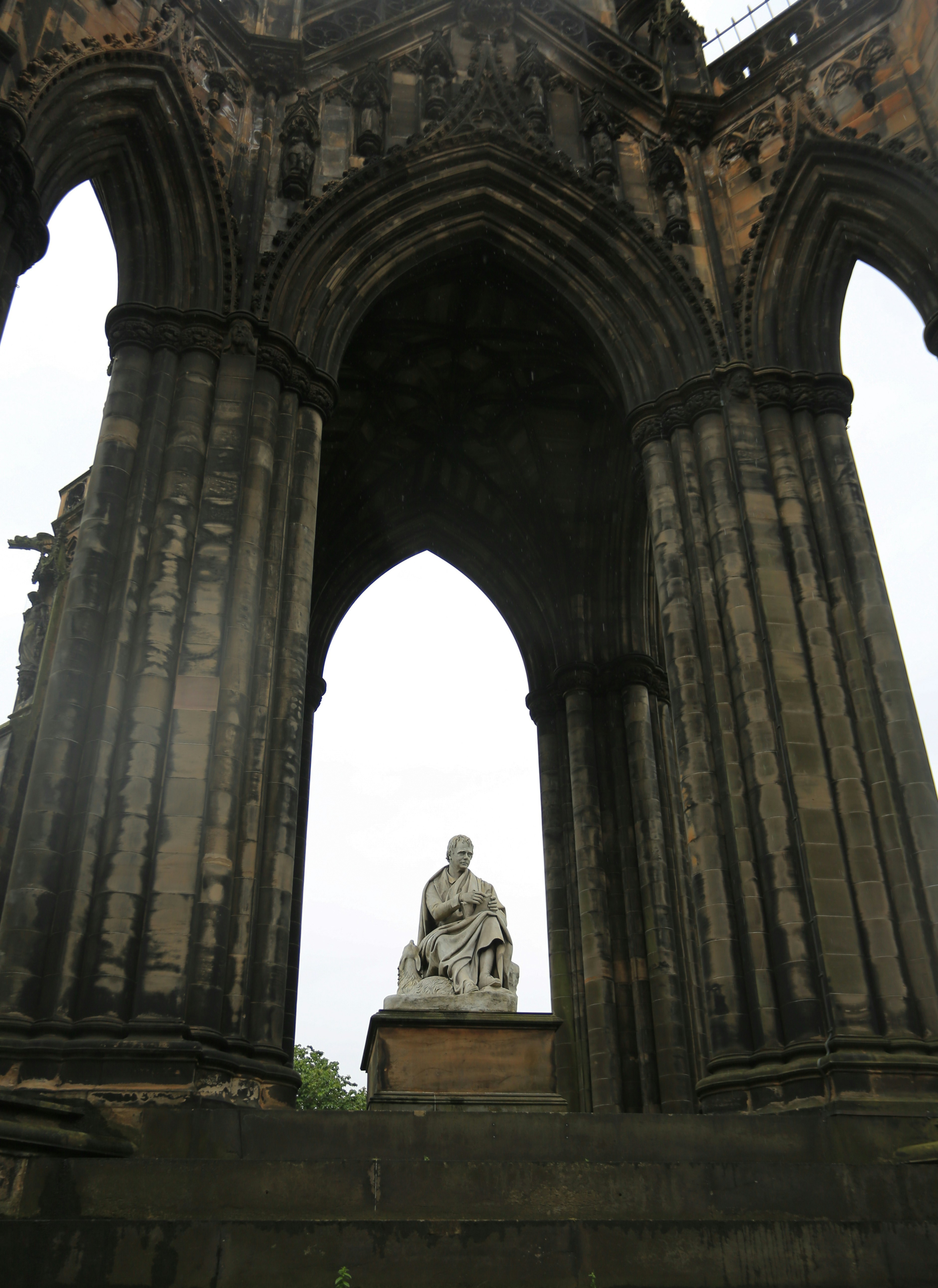Statue Beneath the Gothic Arch: A Silent Centurion of Stone