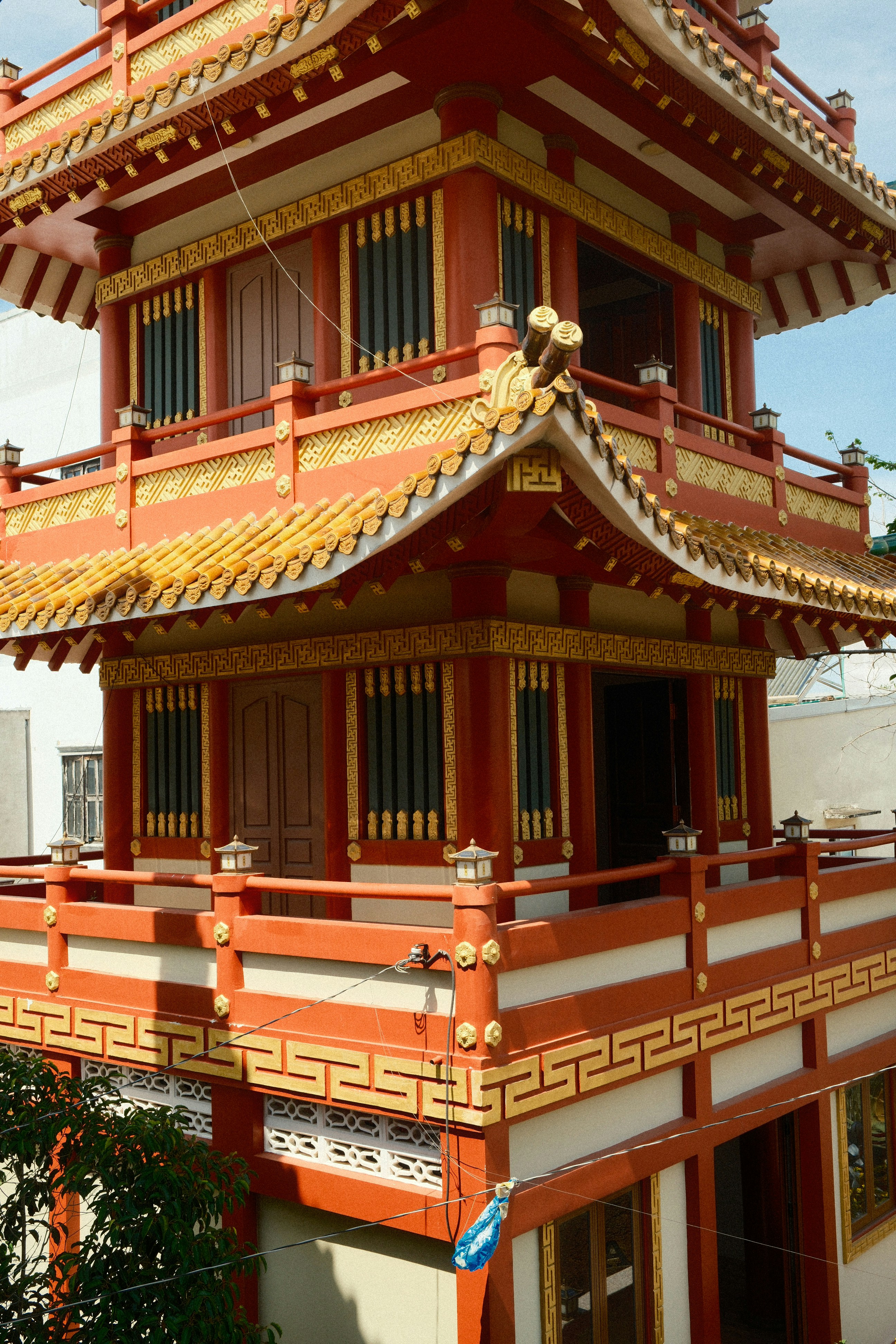 Tiered Temple of Red and Gold: A Cornerstone of Ornate Craftsmanship