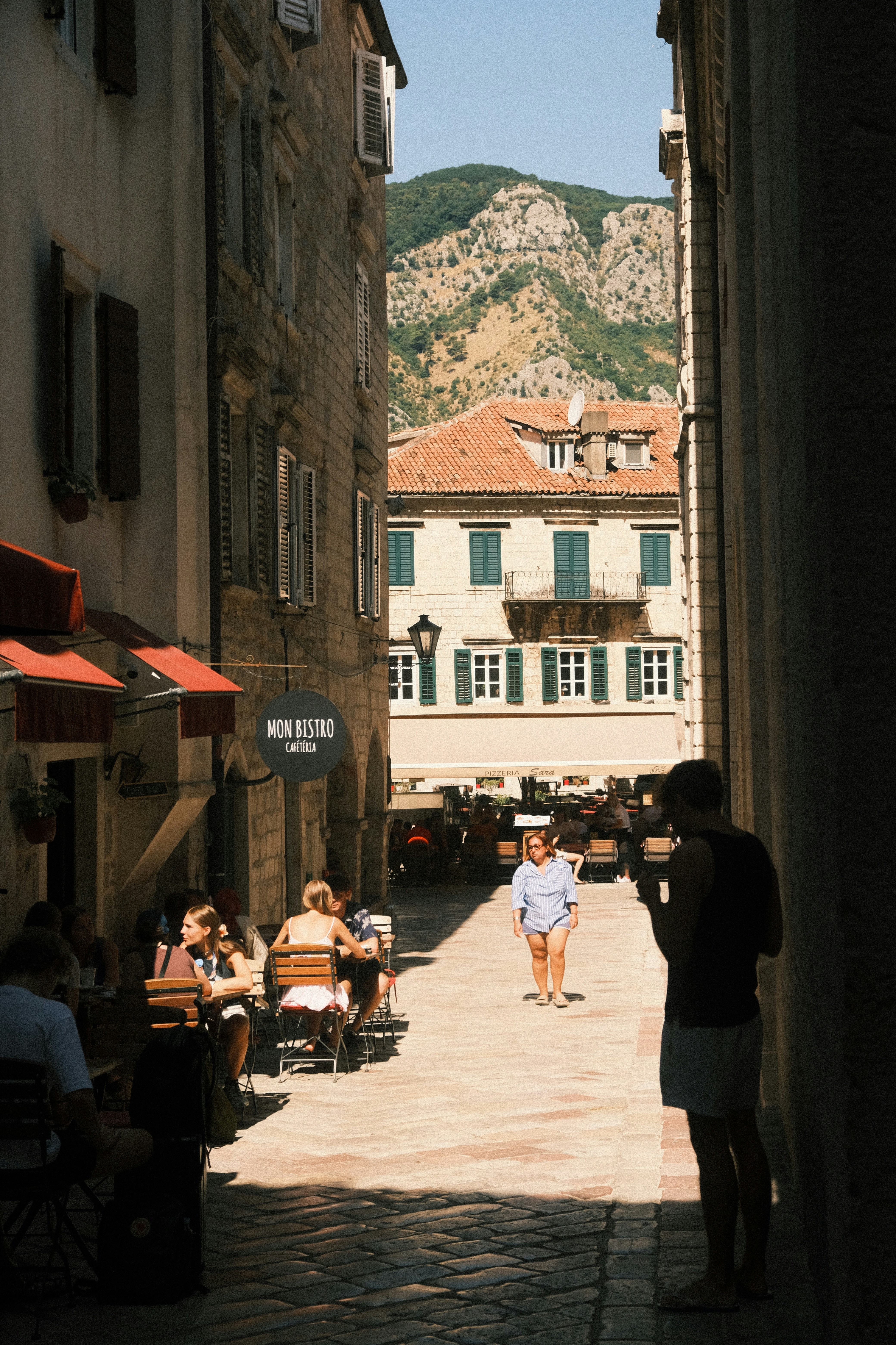 Cobbled Street Quiet Under a Mountainic Guide