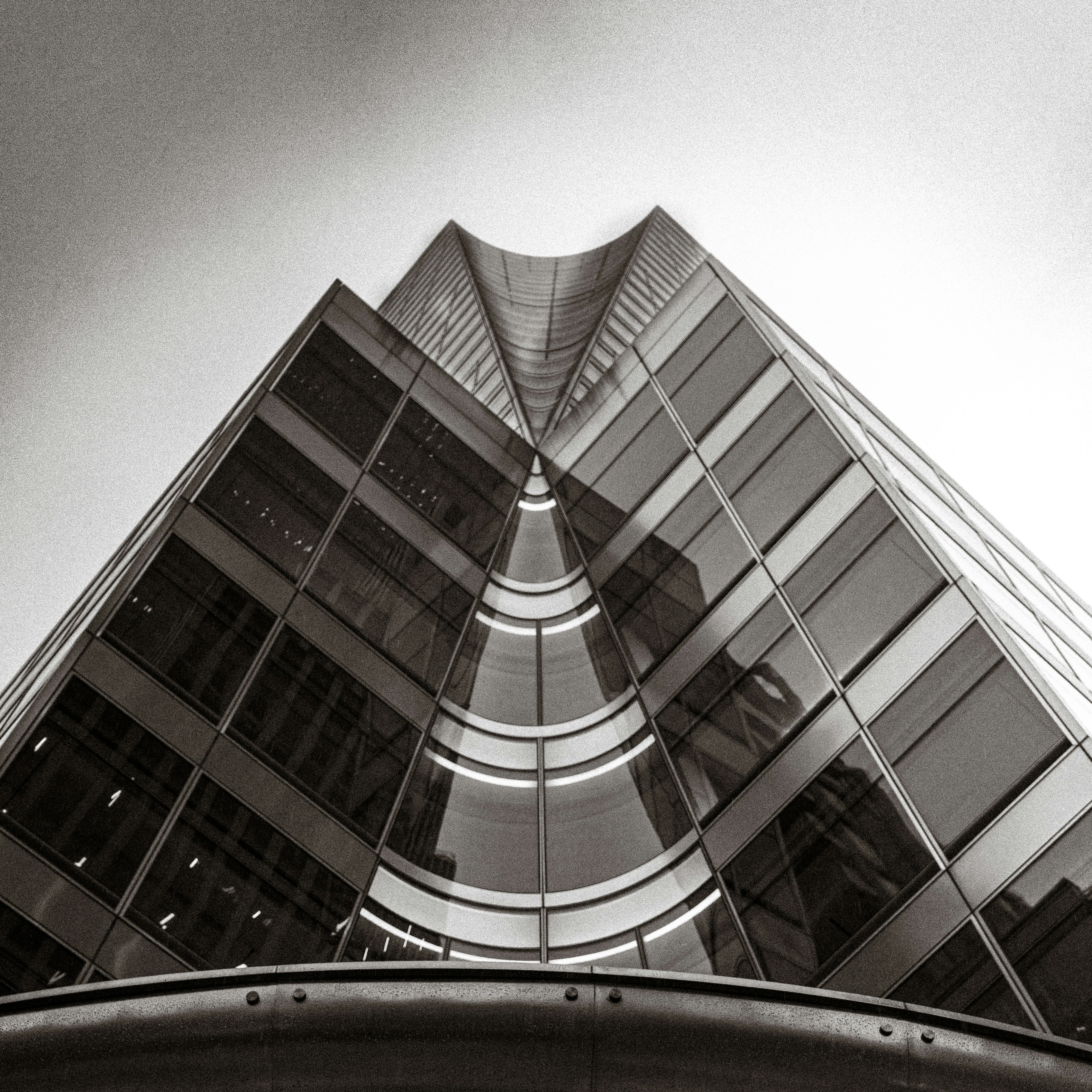 Converging Glass: A Skyscraper’s Symmetry Expands Skyward