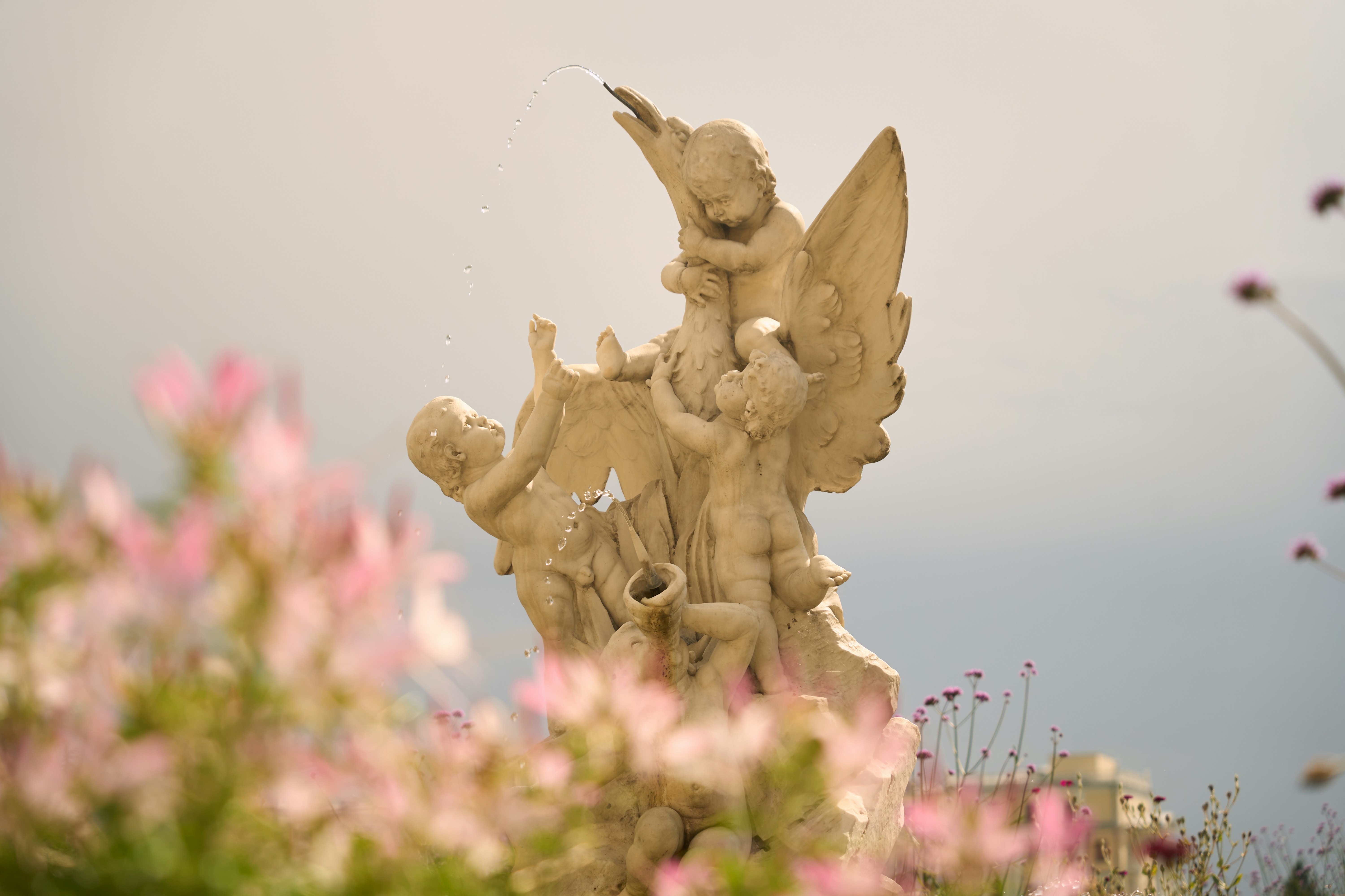 Winged Cherubs Guarding a Weathered Fountain