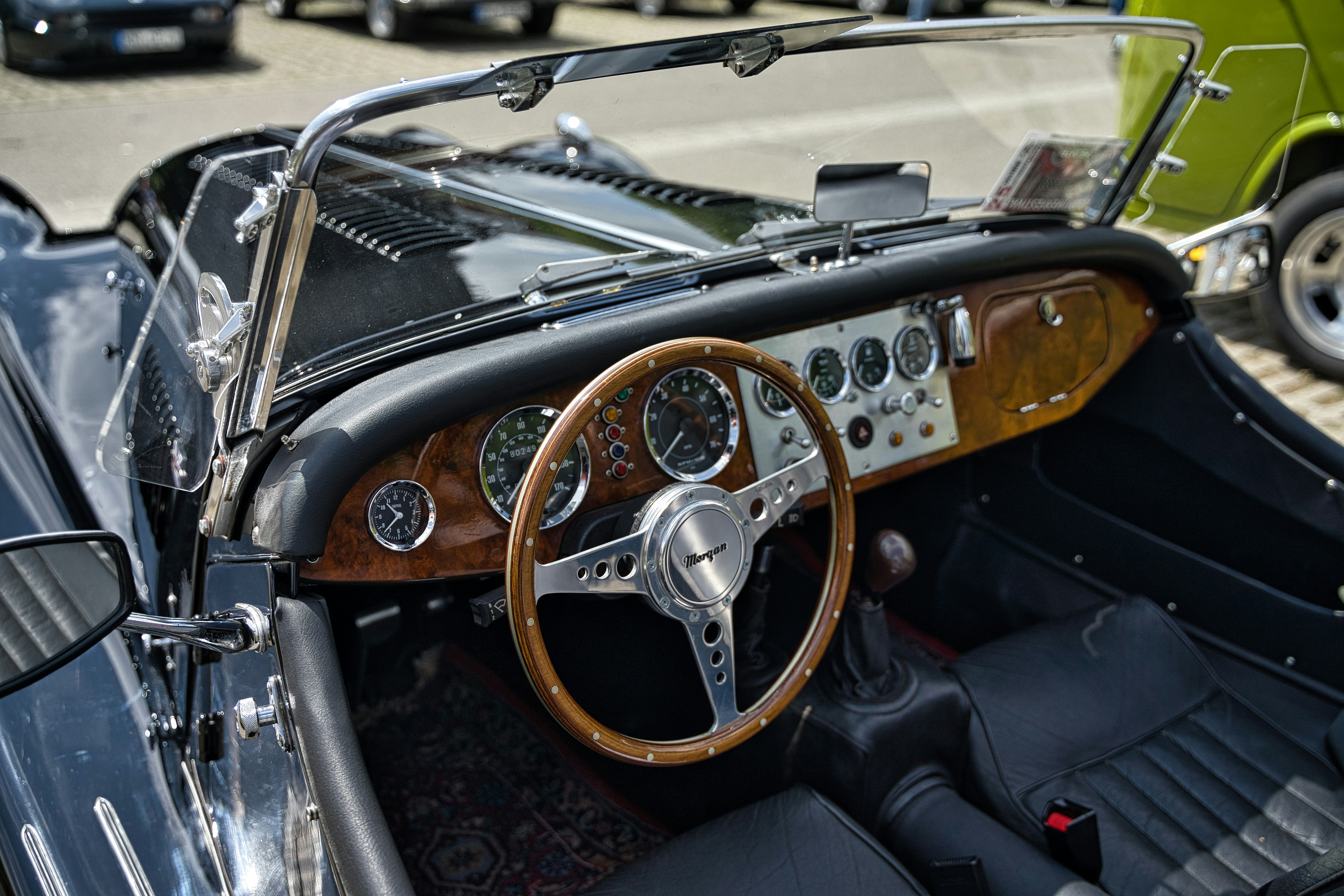 Timeless Wood and Chrome: Vintage Car Cockpit in Focus