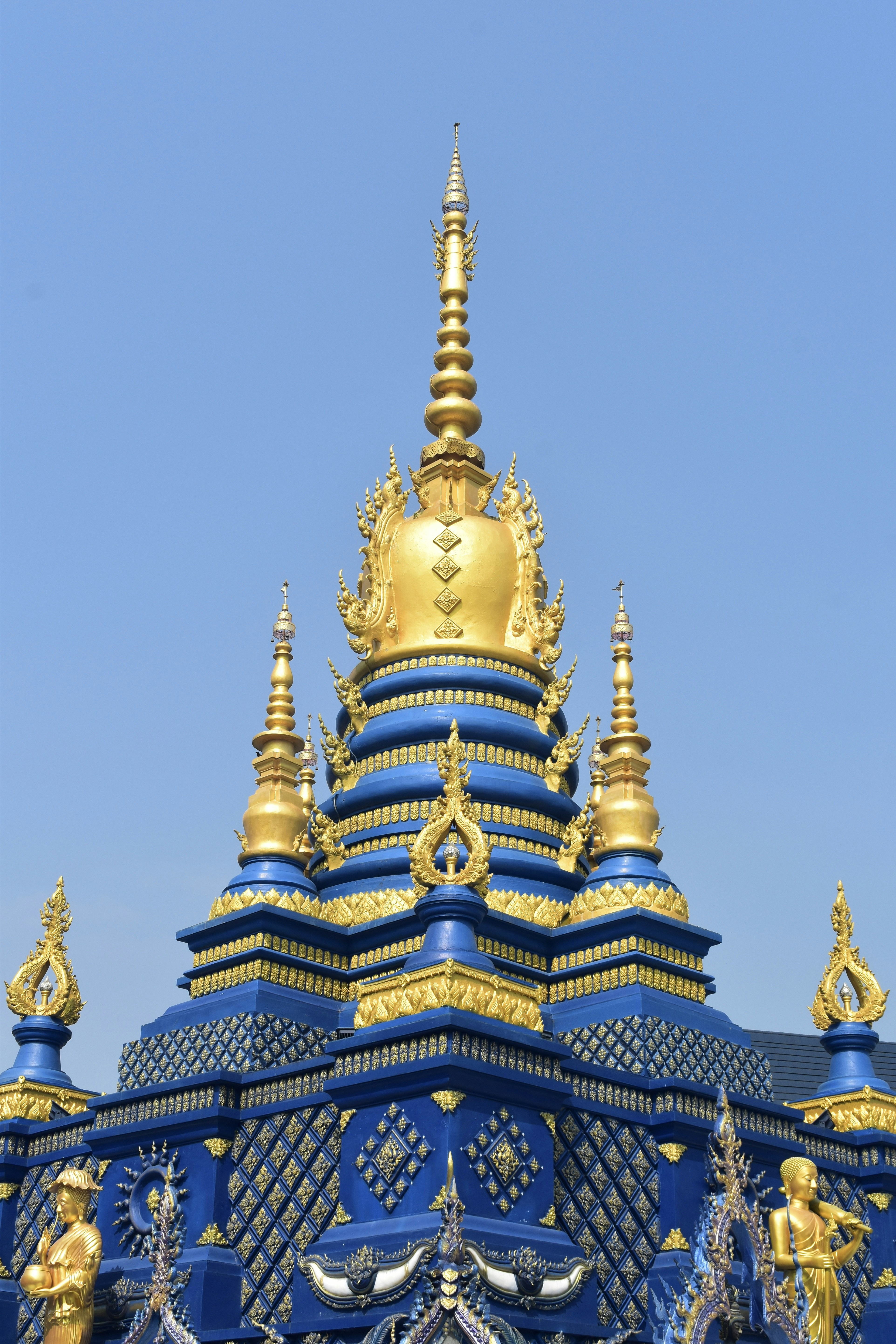 Golden pinnacle crowned in cerulean sky