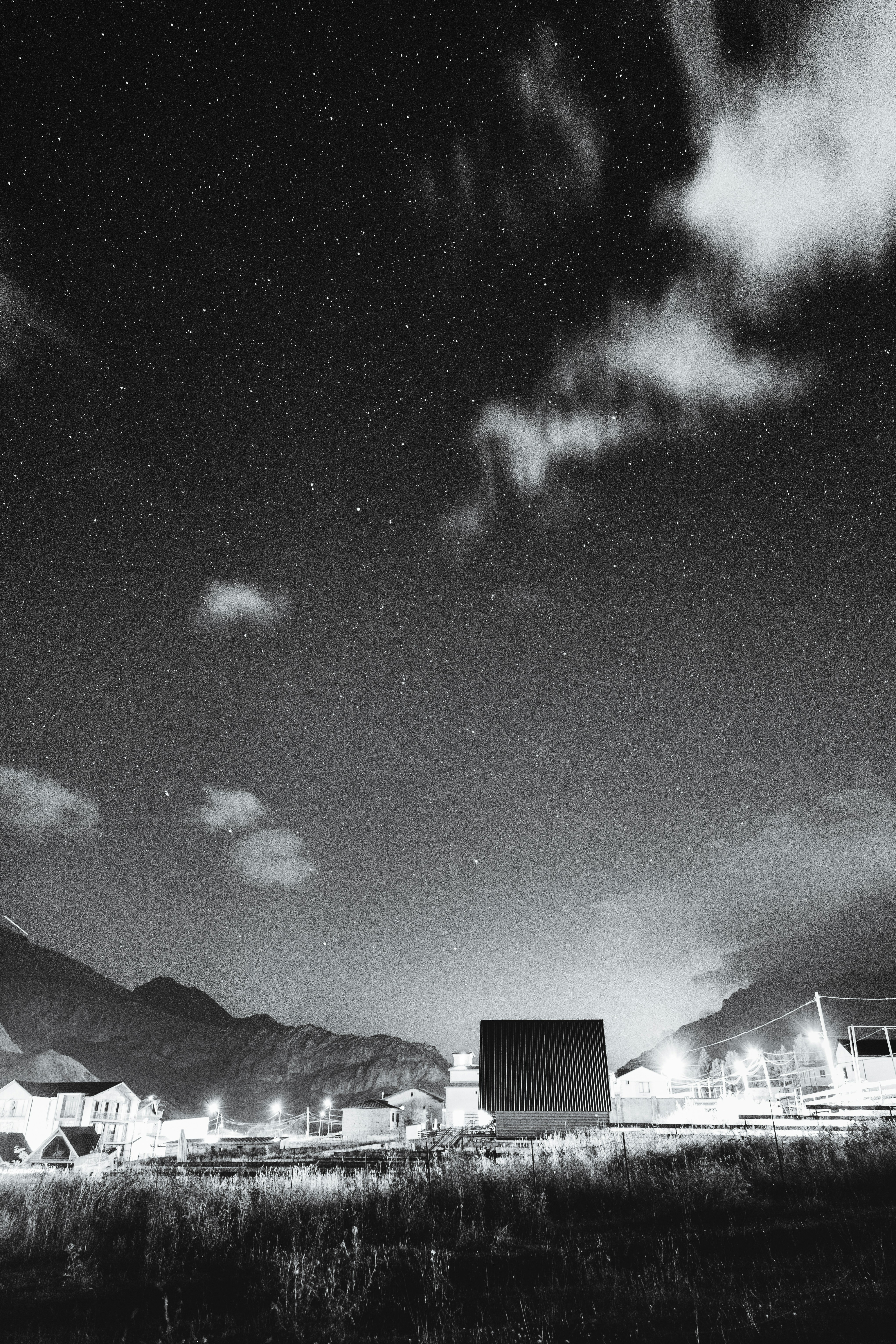Moonlit Valley: A Quiet Night Over the Distant Town