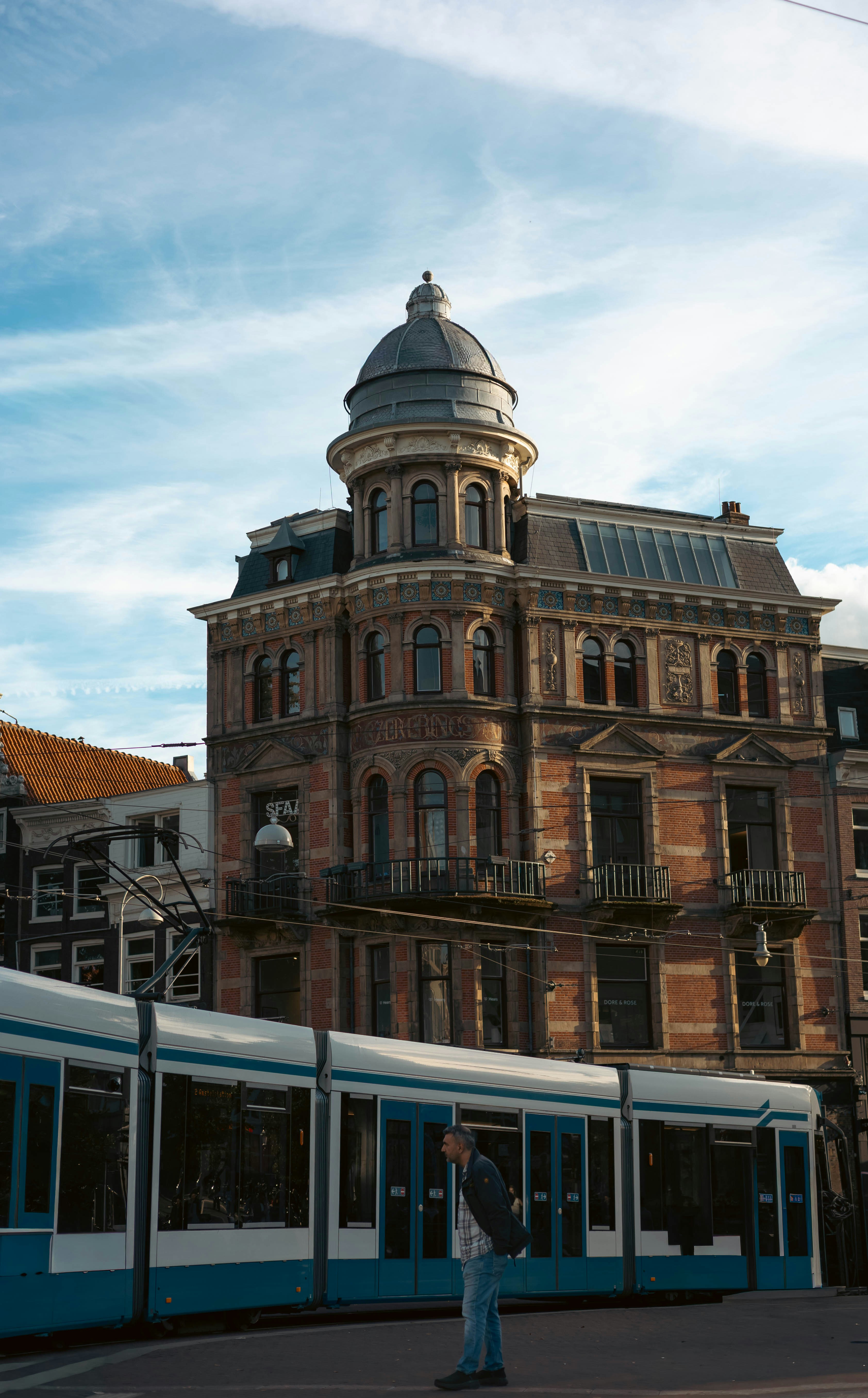 Rooftop Dome Over a City Tram: A Historic Facade Meets Modern Transit