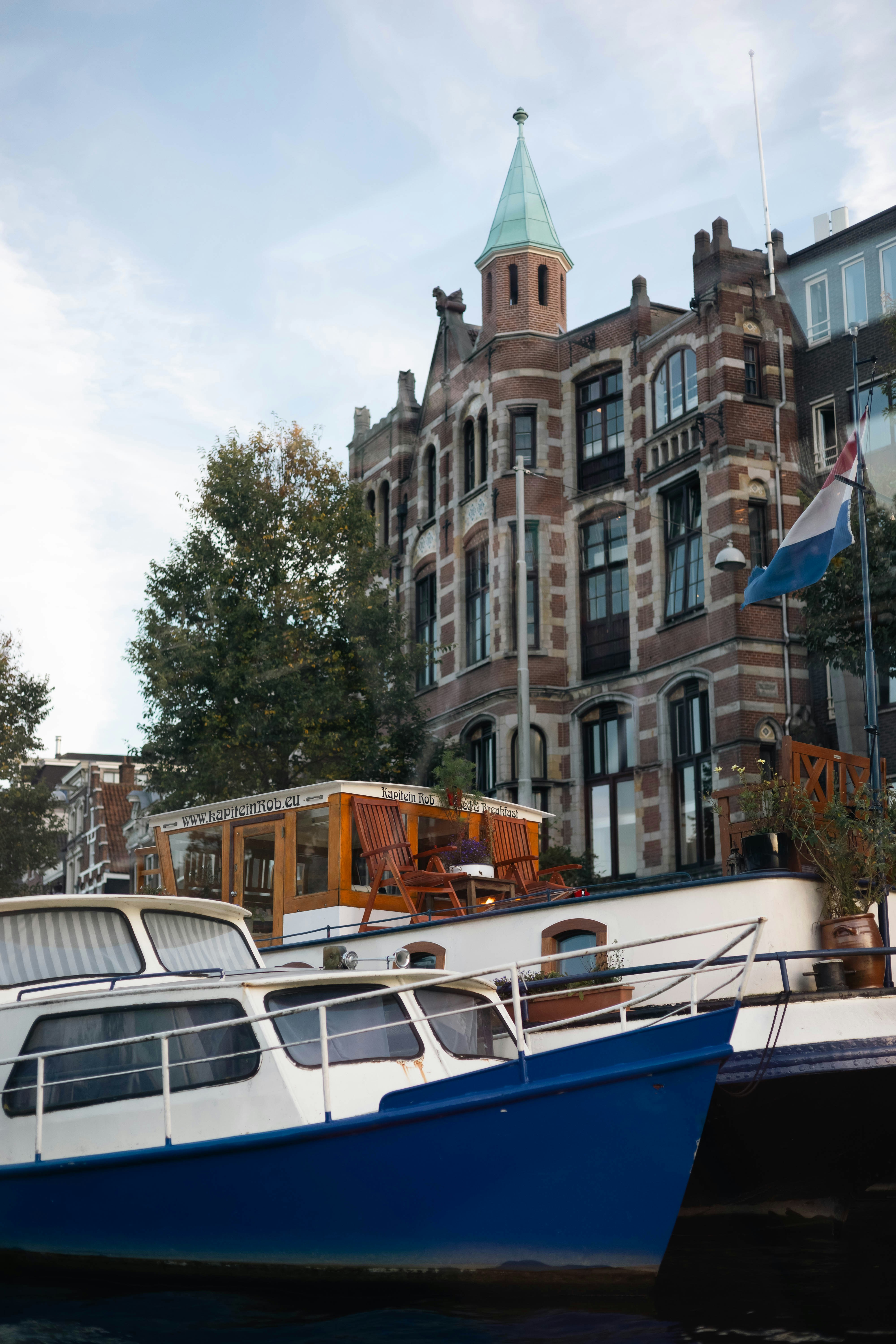 Harborfront Portrait: Boats at Rest Before the Brick Facade