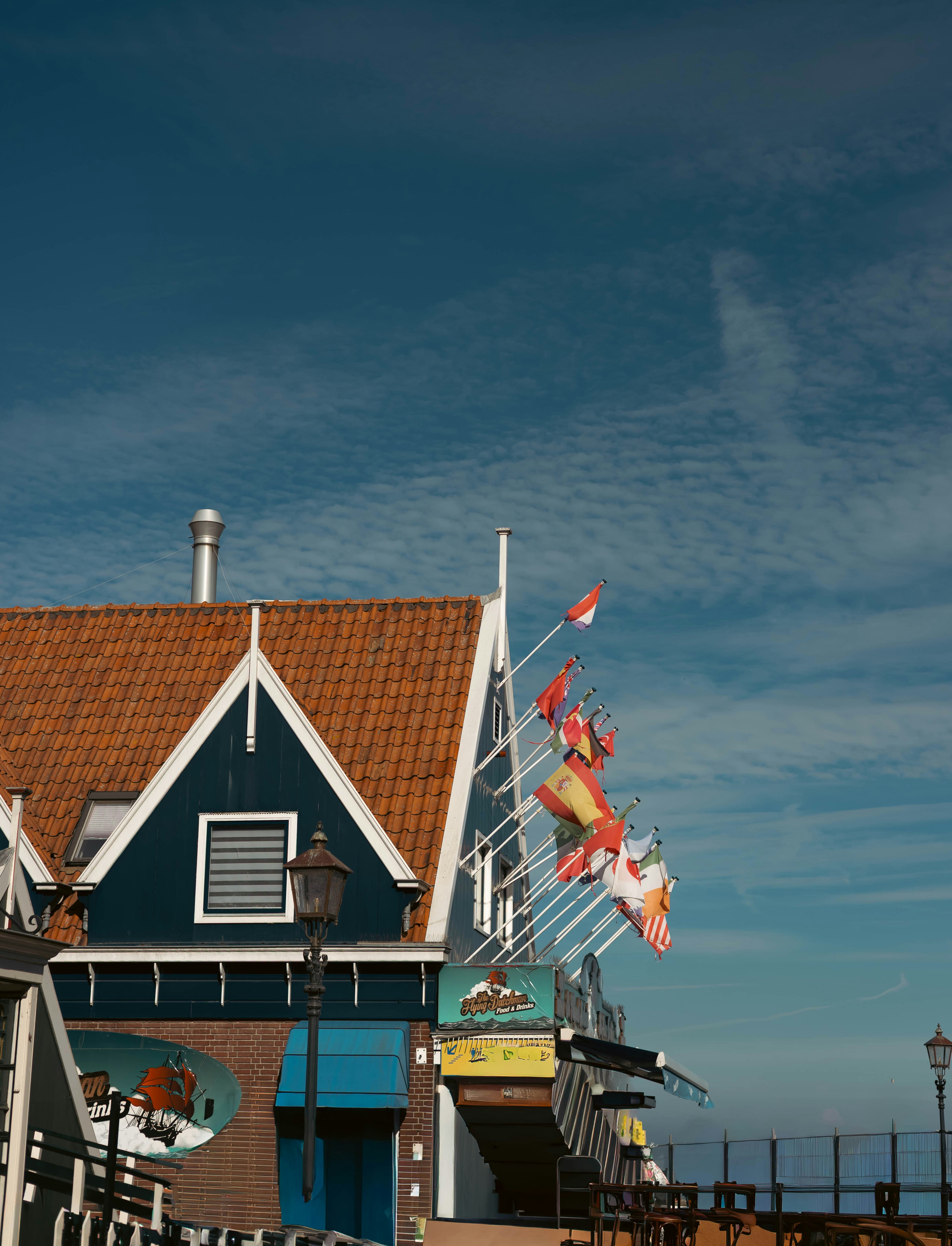 Colorful seaside inn under a bright blue sky